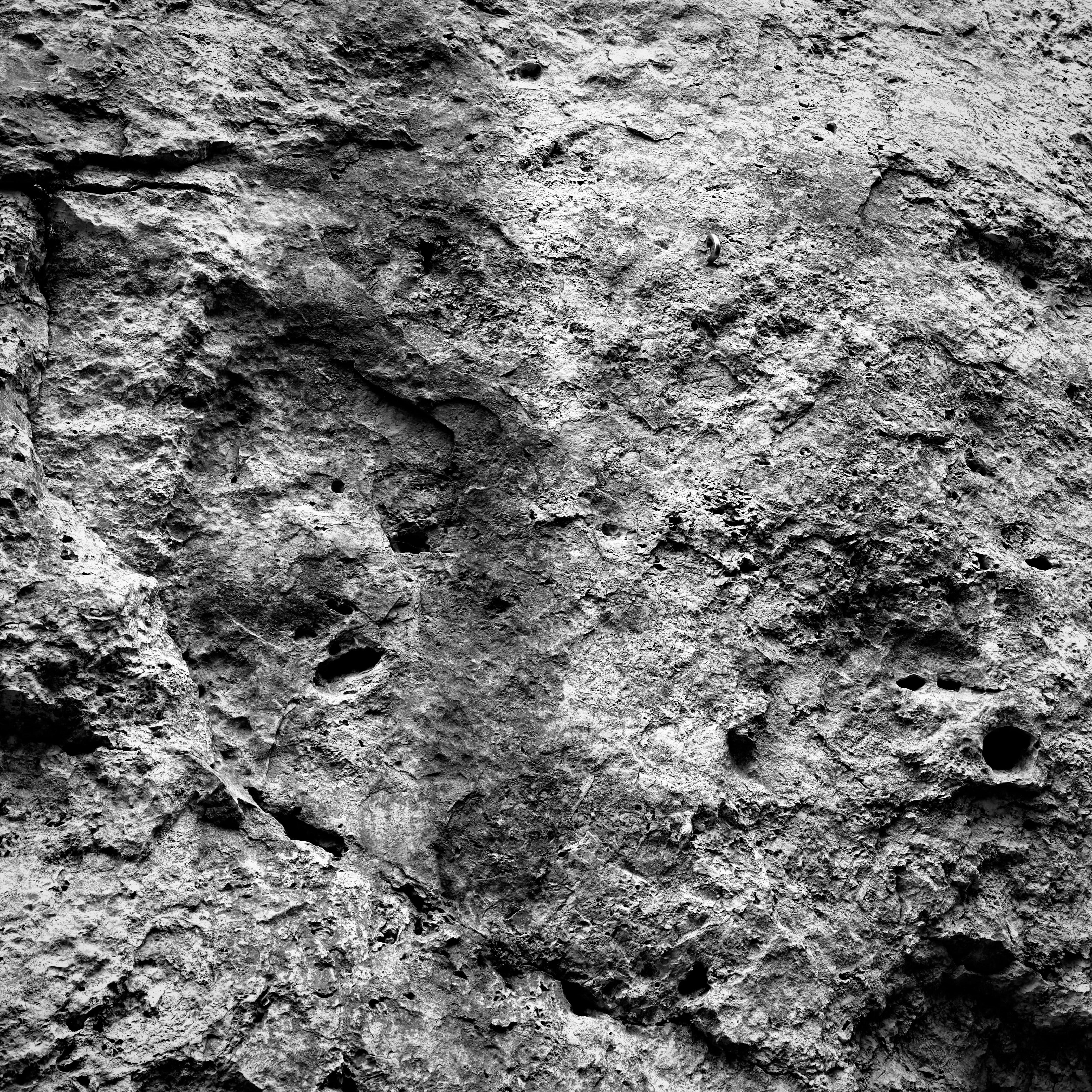 A black and white photo of a rock face photo – Free Background Image on ...