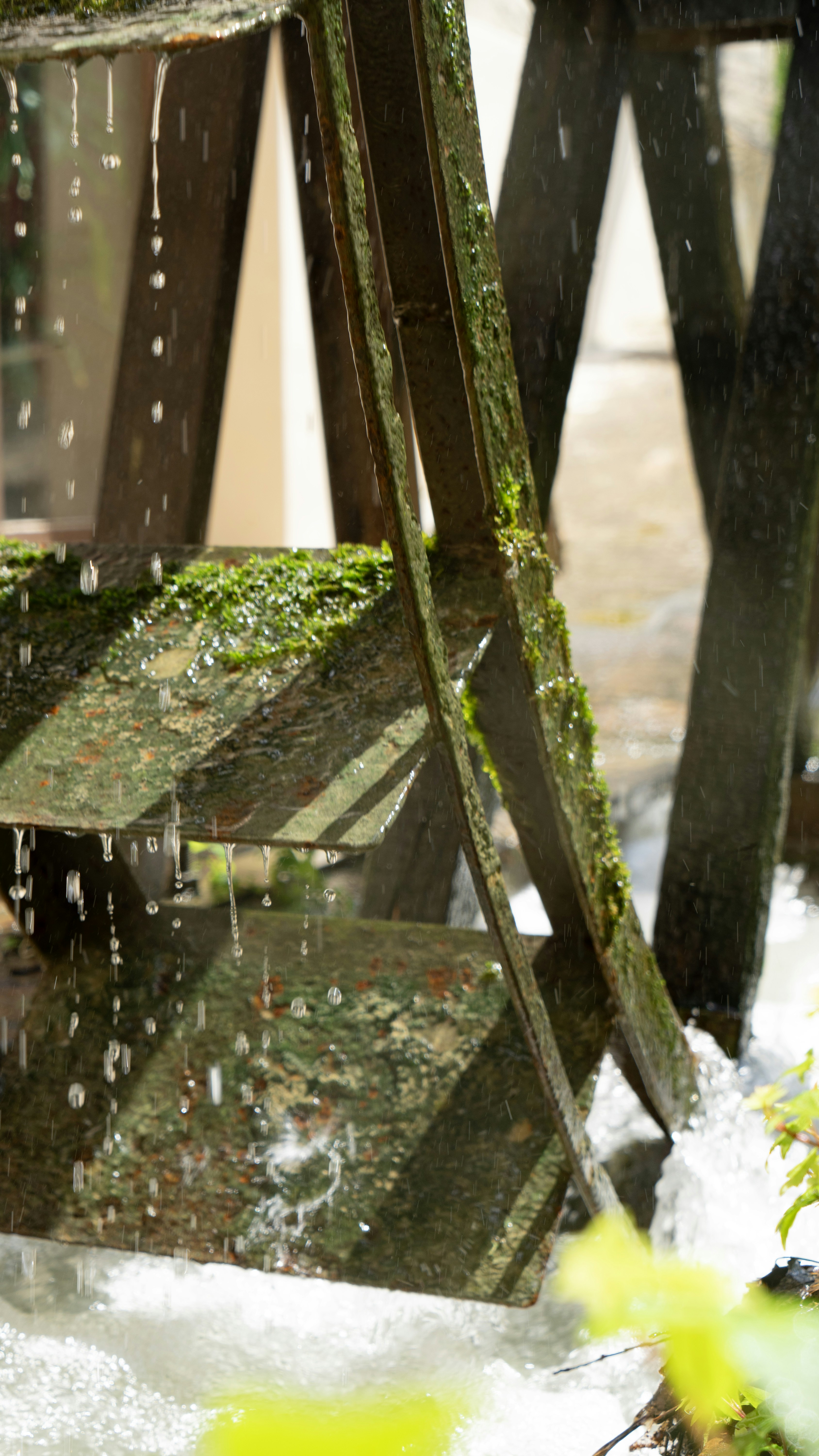 A wooden structure with water coming out of it photo – Free Forest ...
