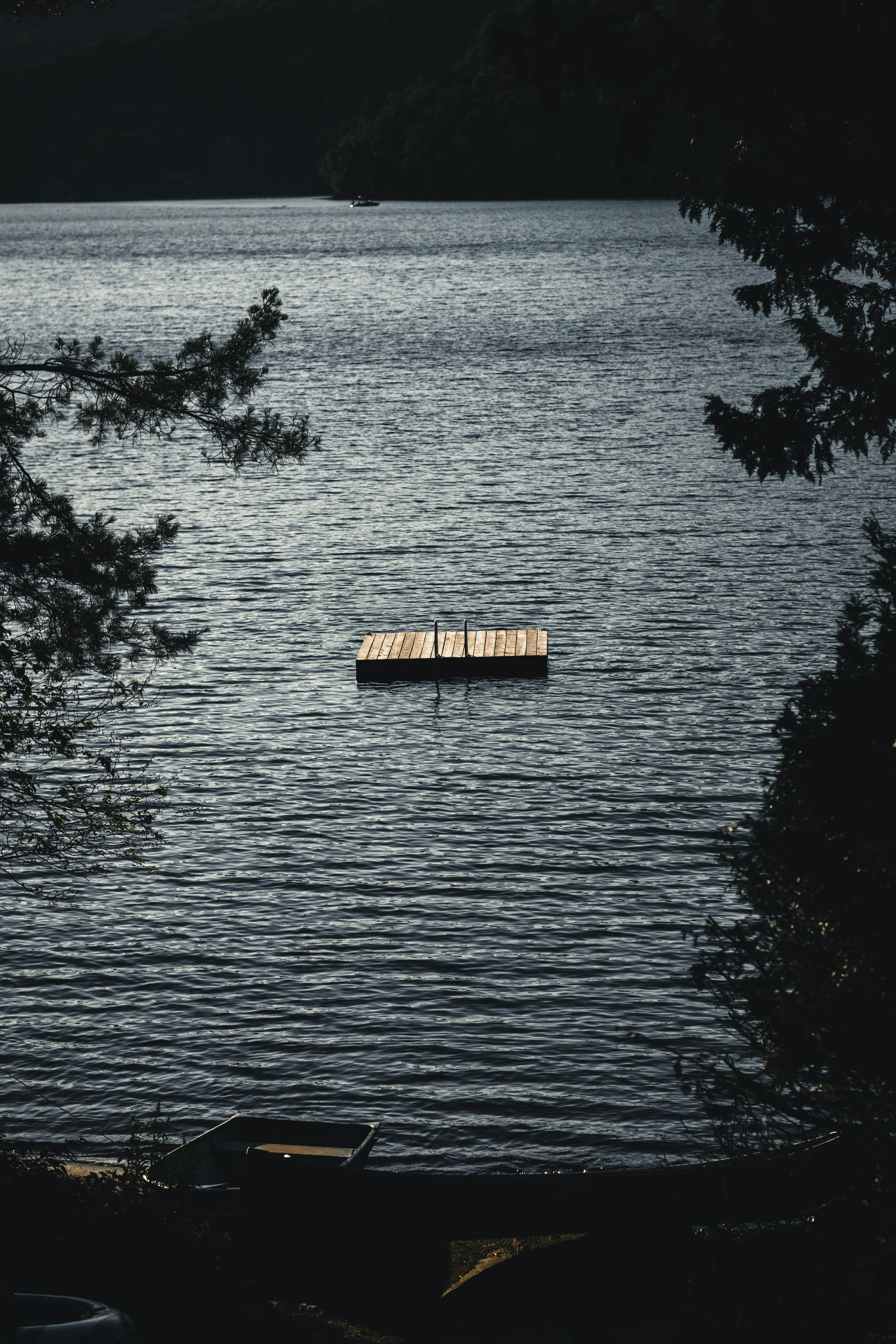 Solitary Dock in Quiet Light on a Rippling Lake