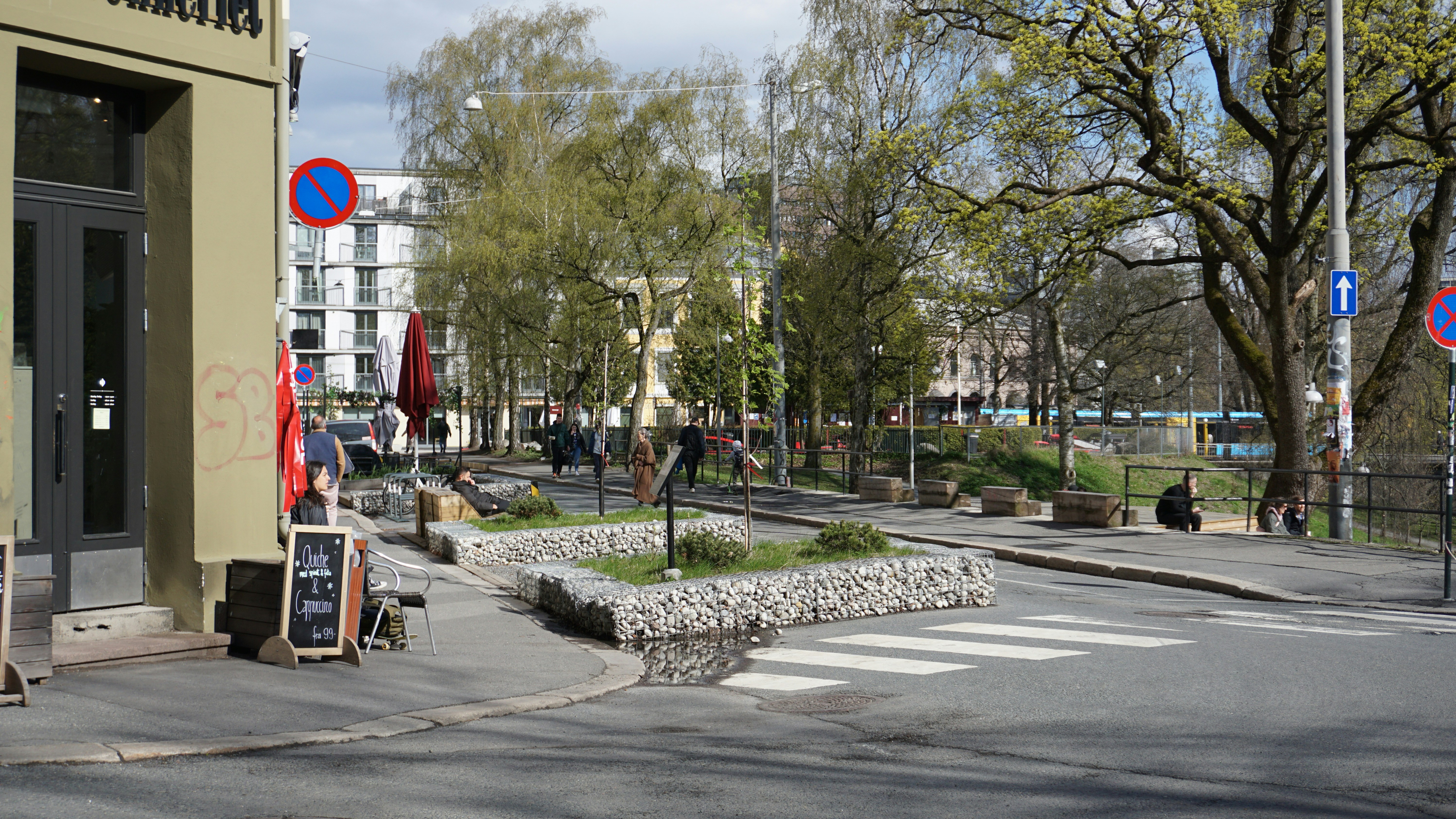 A street corner with a crosswalk and trees photo – Free Summer street ...