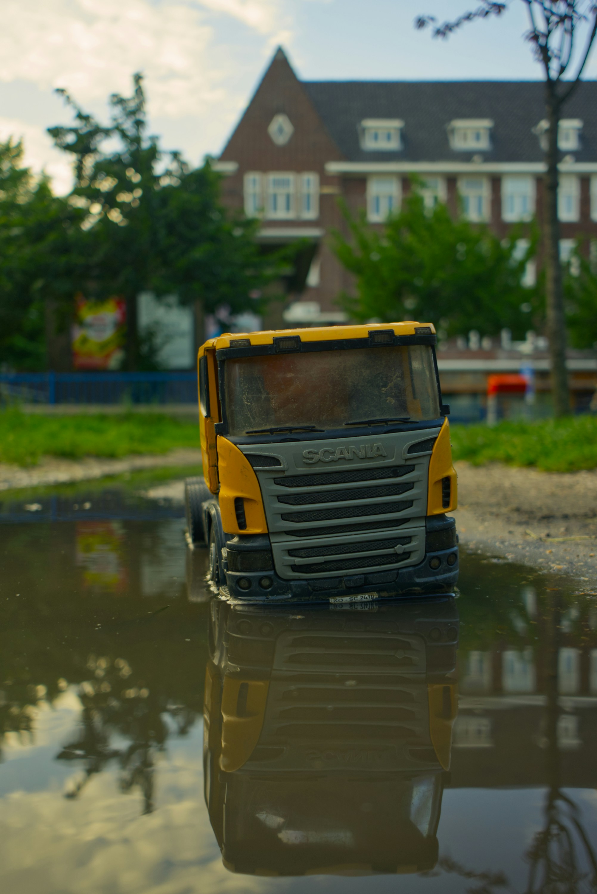 Miniature Truck's Reflection in a Puddle