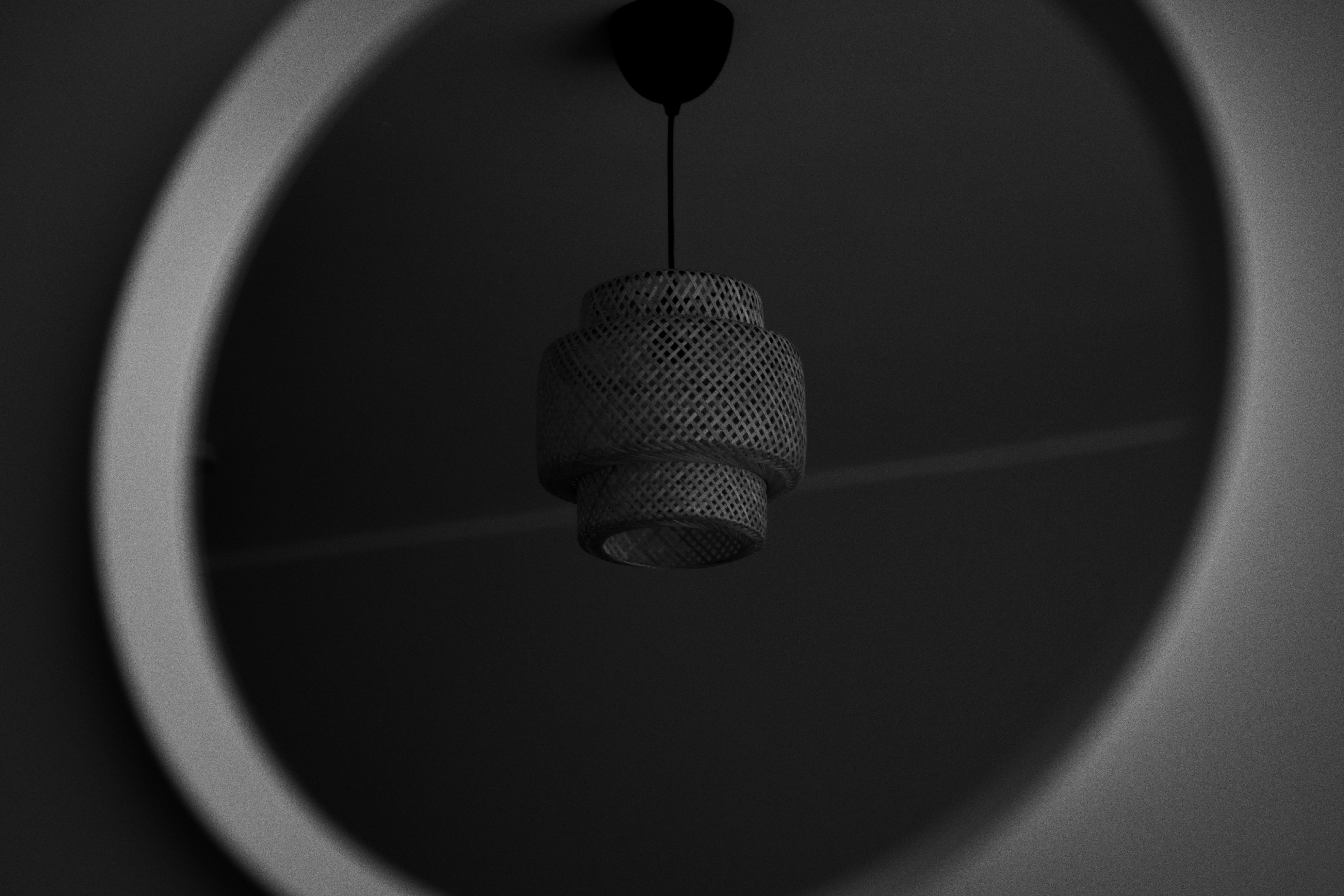 Midnight Ring: A Suspended Pendant in a Circular Frame