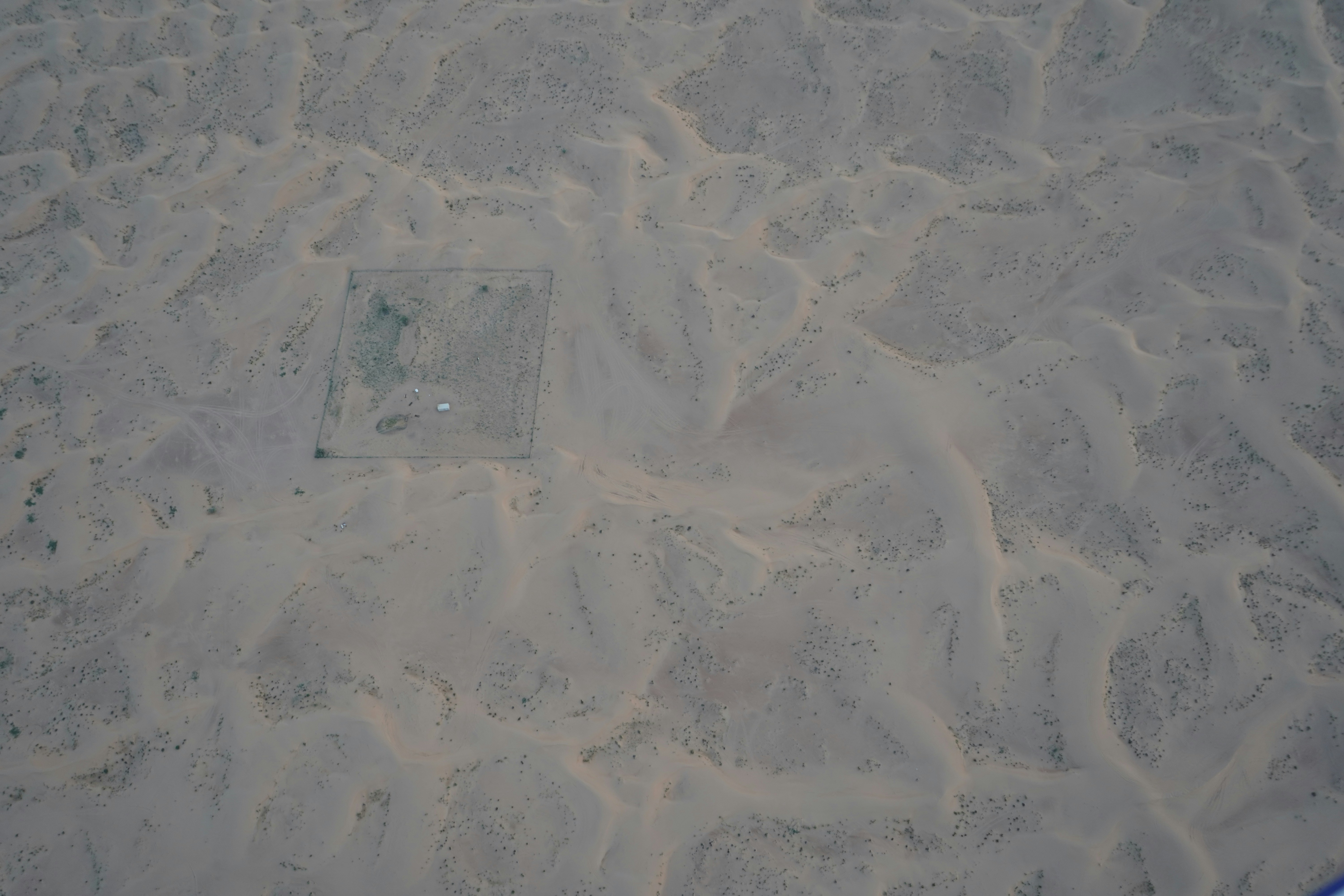 A square shaped object in the sand on a beach photo – Free Grey Image ...