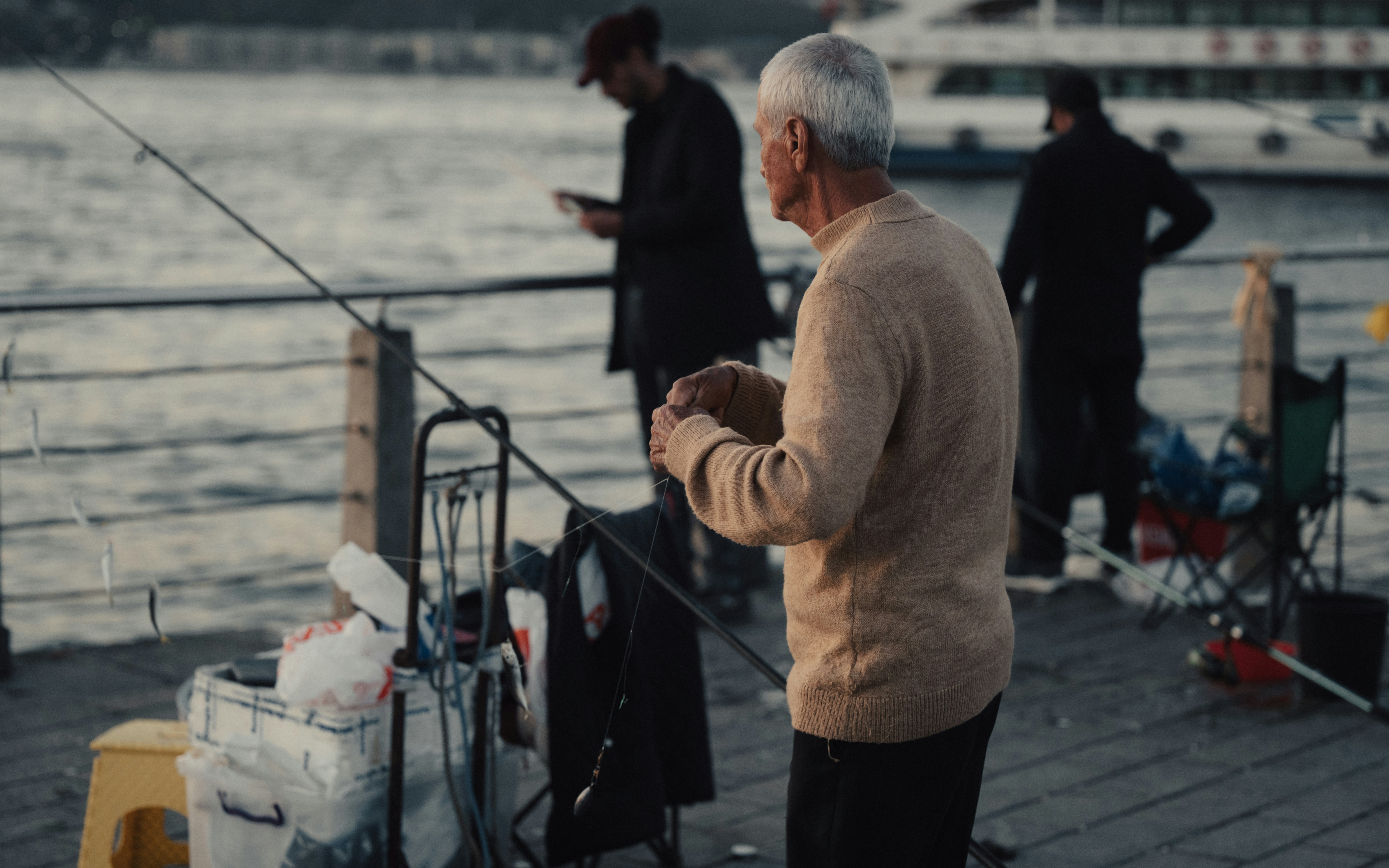 Quiet Resolve at the Pier: An Elder Watches the Harbor