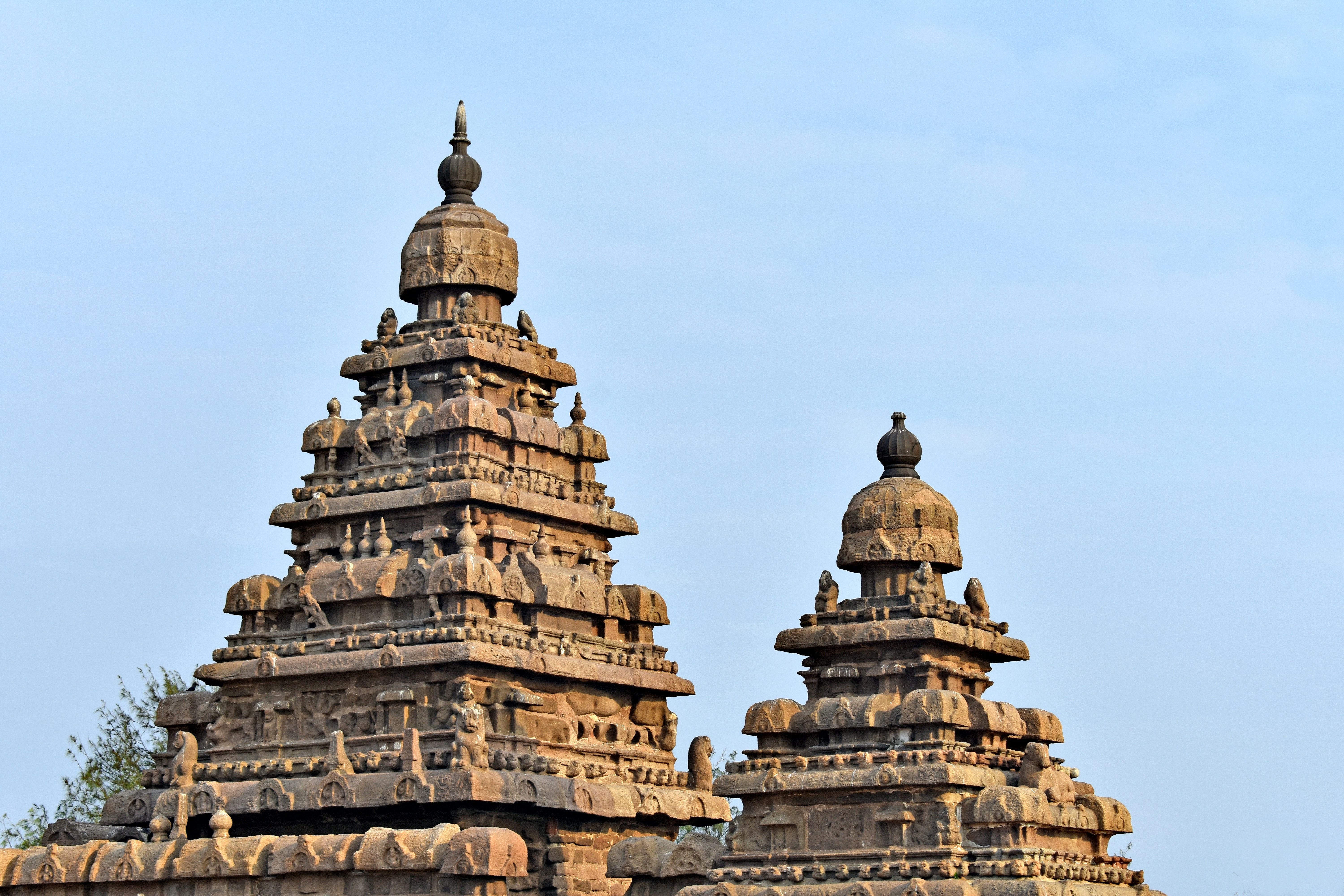 Twin Sandstone Spires Rise Under a Calm Blue Sky