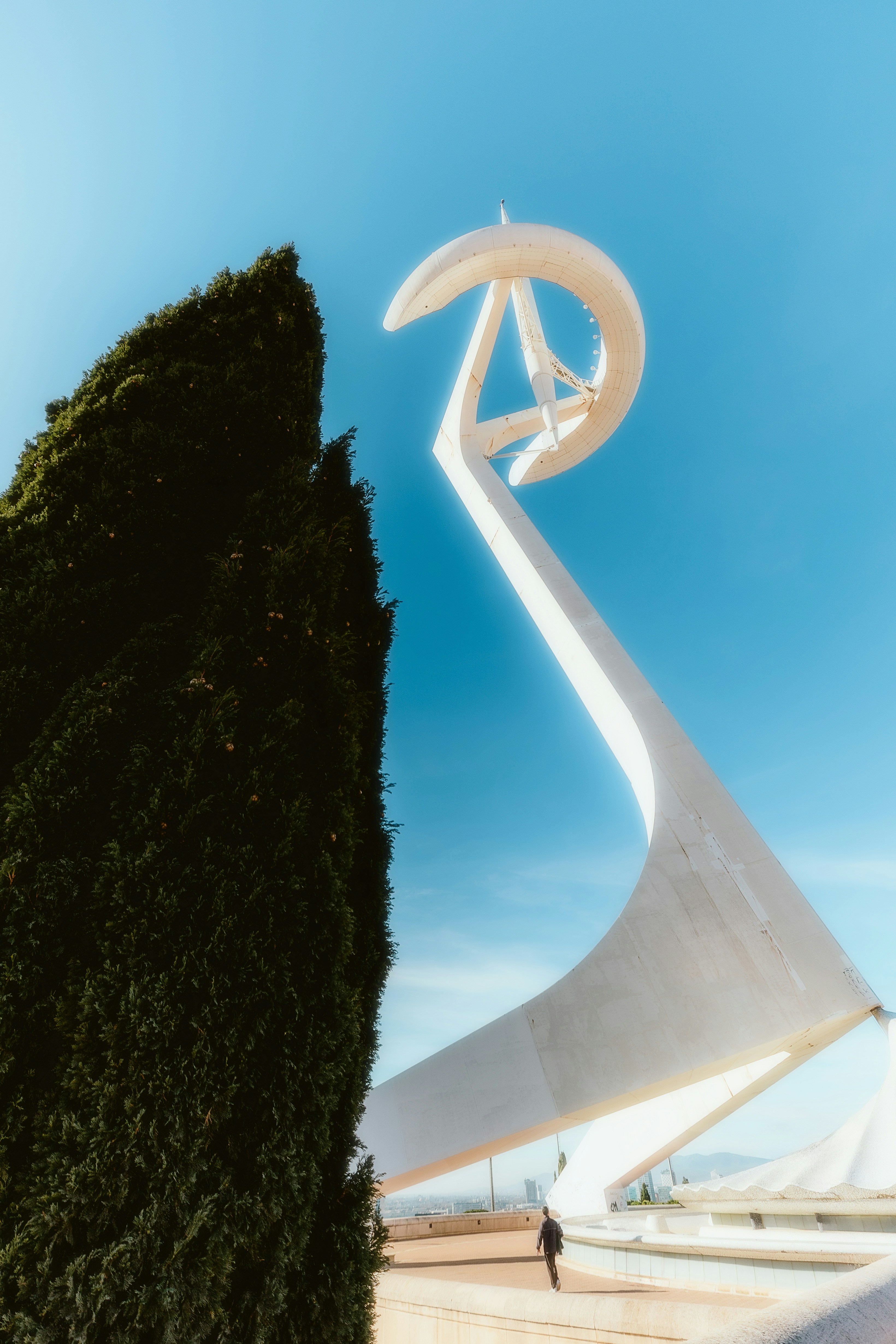 Looped Crescent Spire Rising Over the Plaza