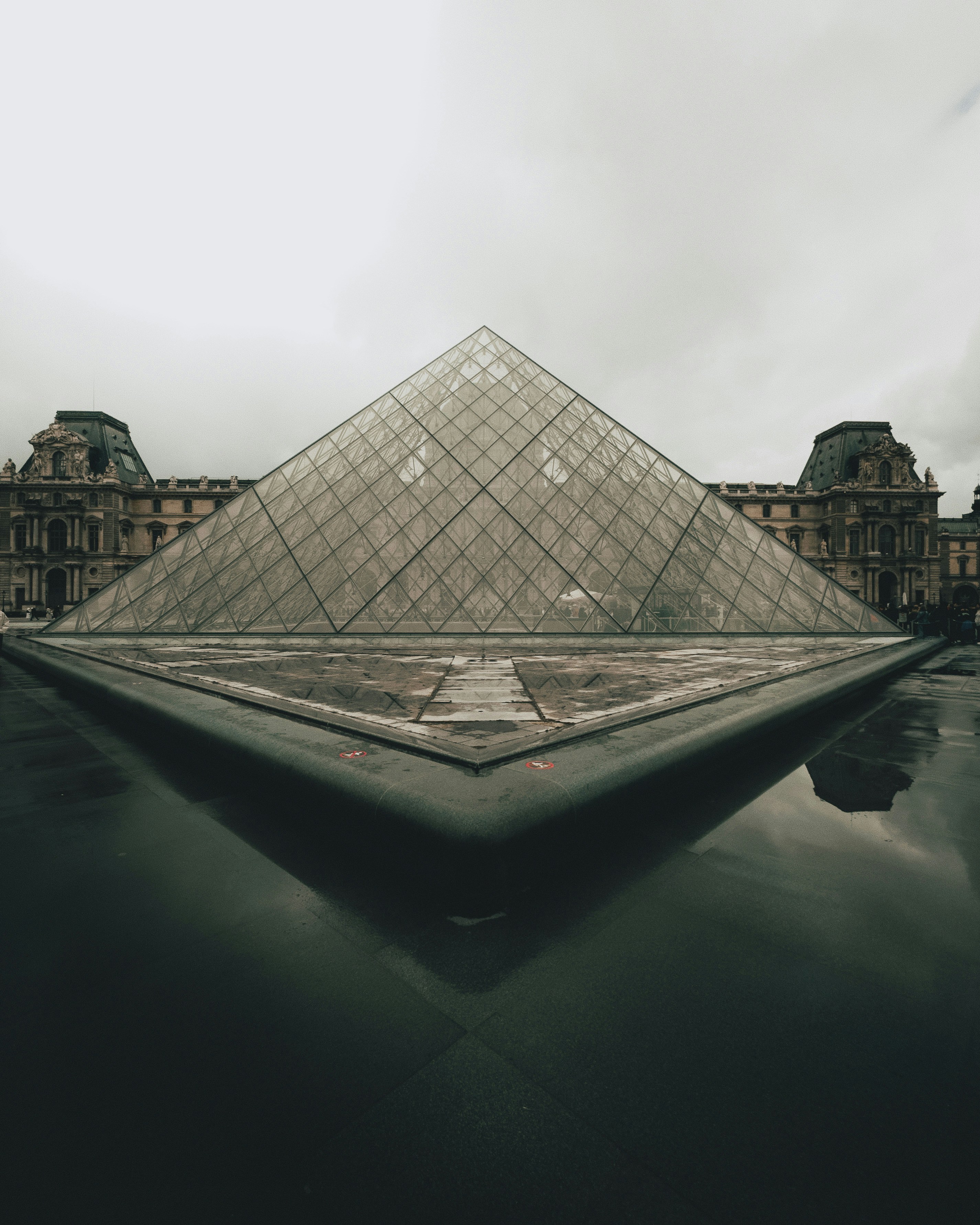 A large pyramid sitting in front of a building photo – Free Louvre ...