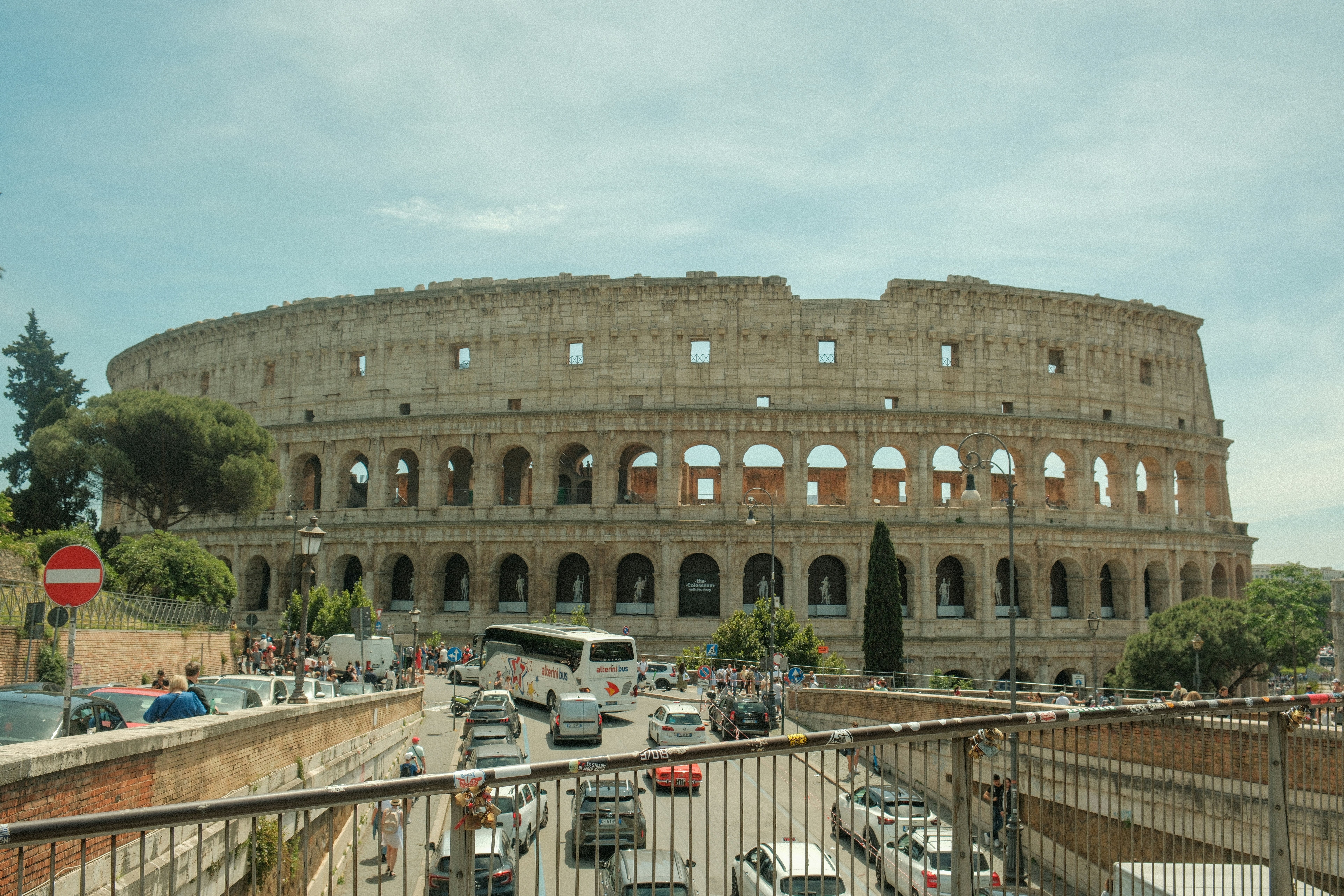 Colosseum in Motion: Rome's Ancient Ellipse Framed by Modern Traffic