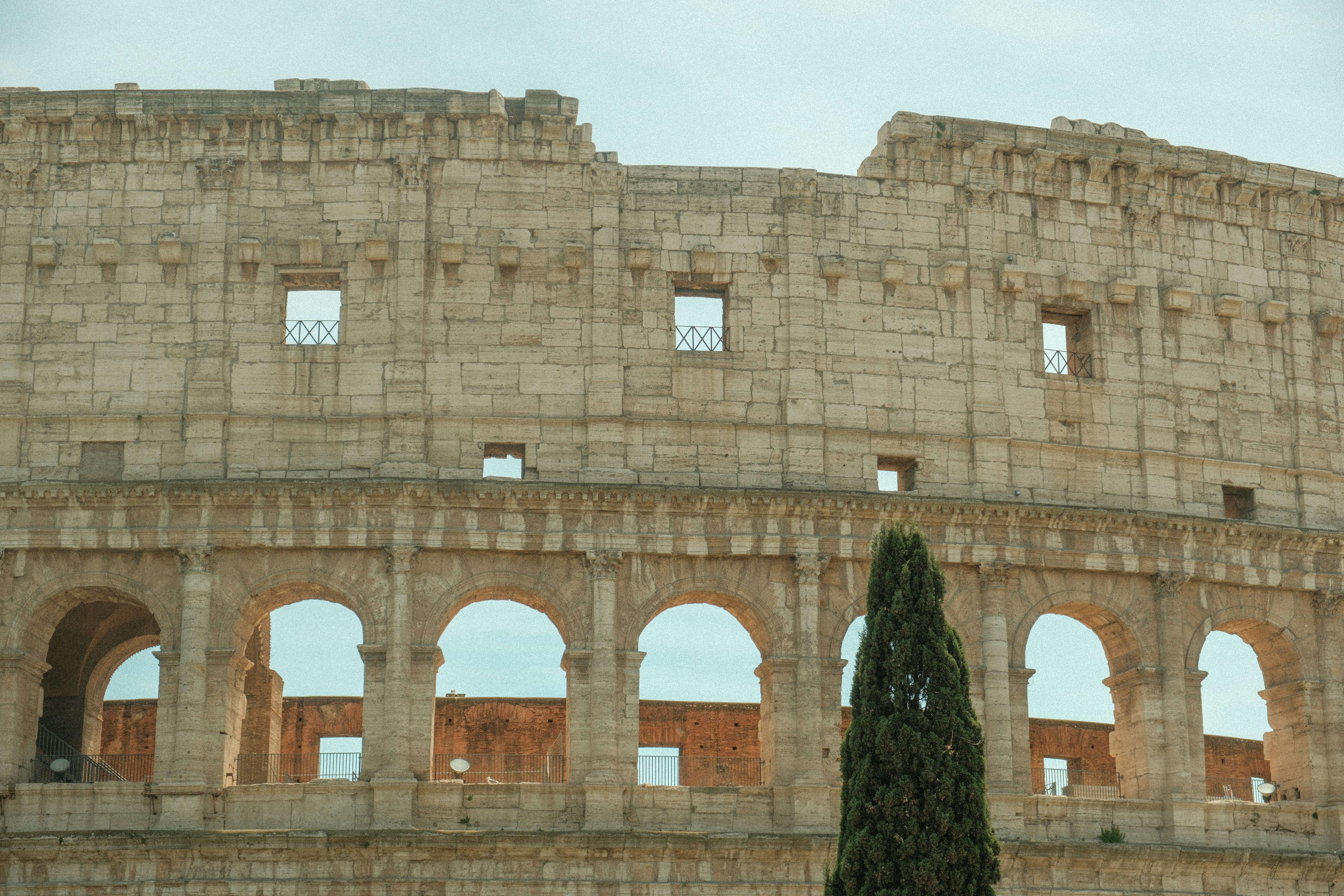 A large stone building with a clock on the front of it photo – Free ...