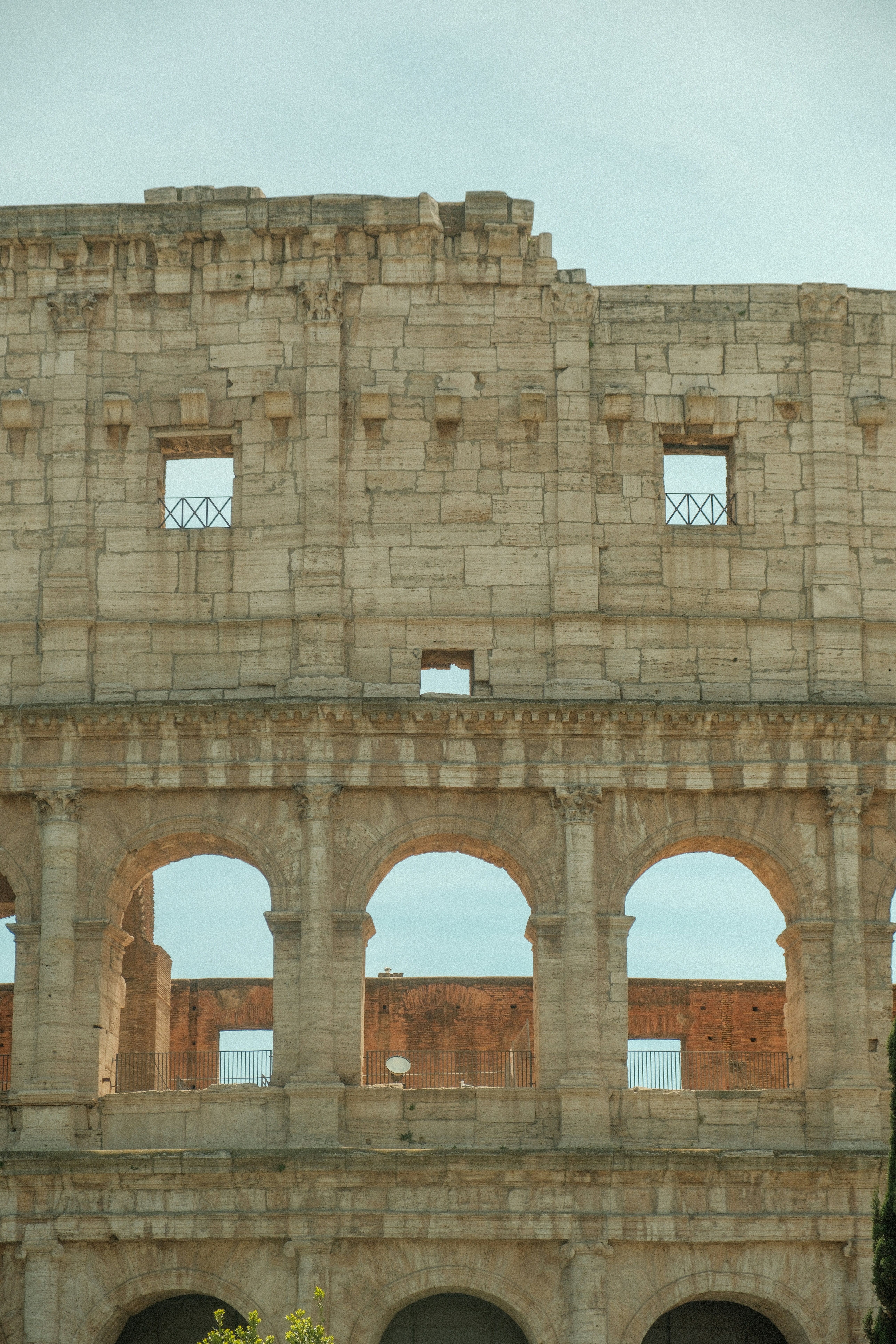 A large stone building with four arched windows photo – Free Rome Image ...