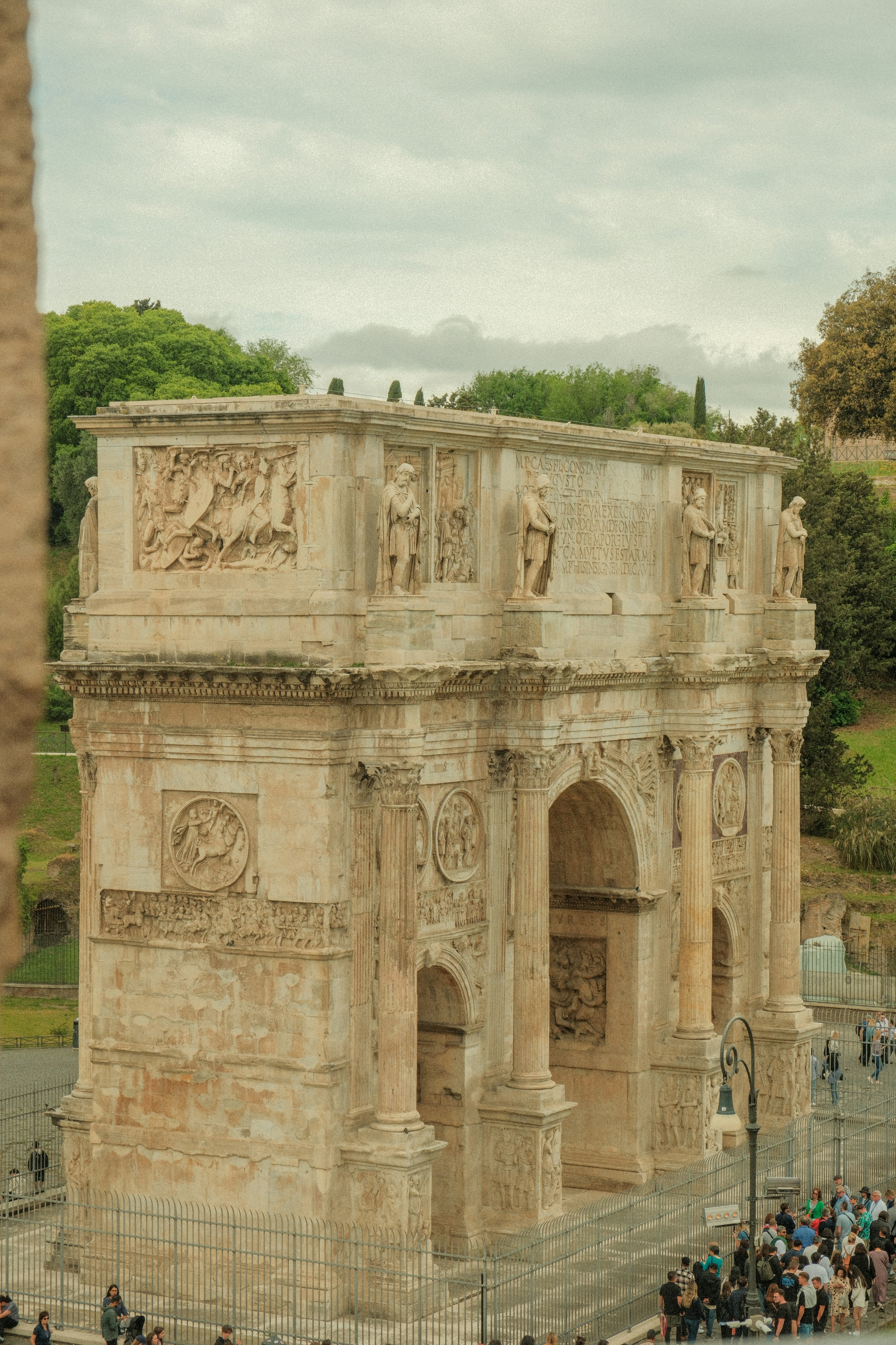 Reliefs in the Park: A Stone Arch Crowned by Crowds and Clouds