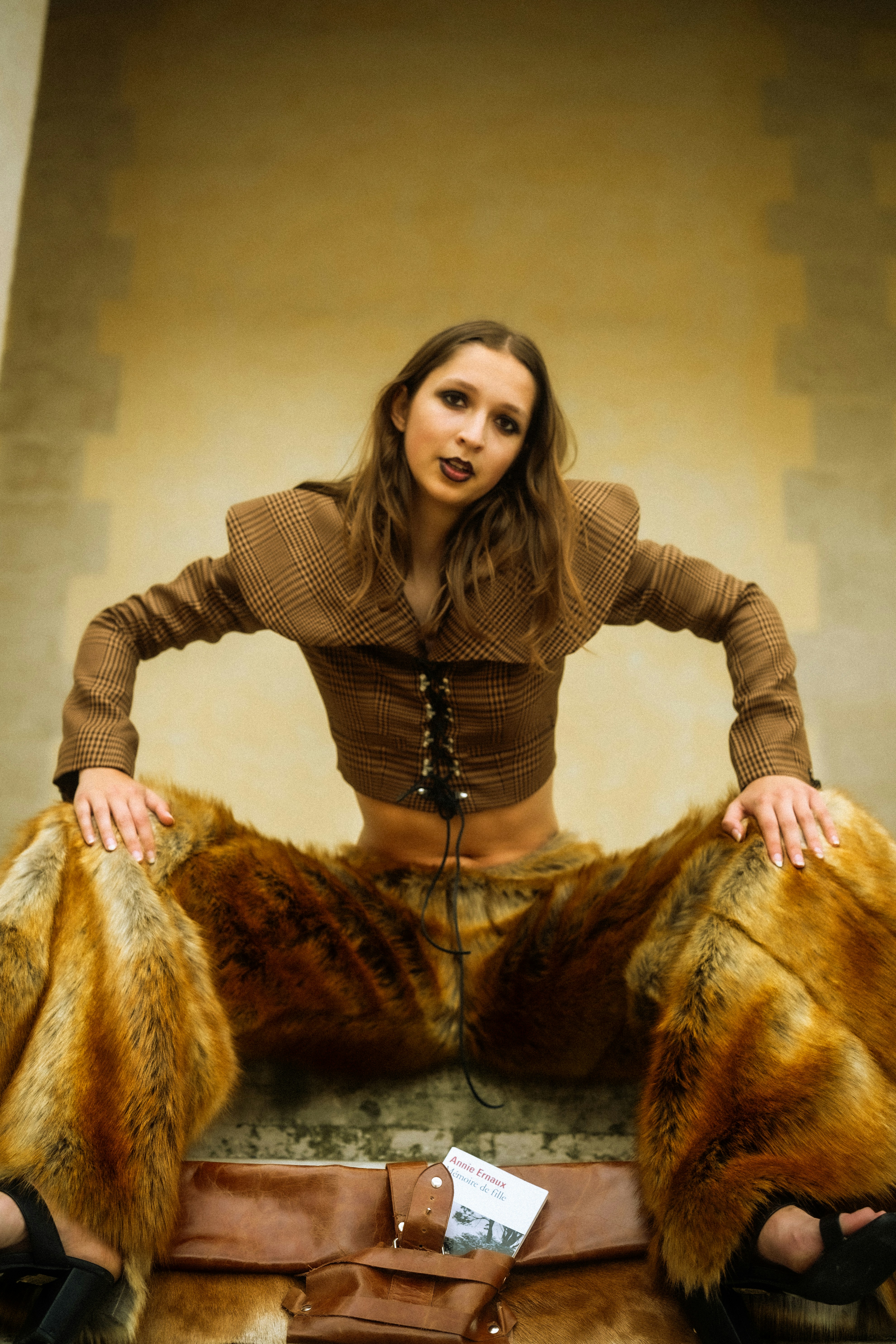 Gilded Confidence: A Pose in Fur and Plaid