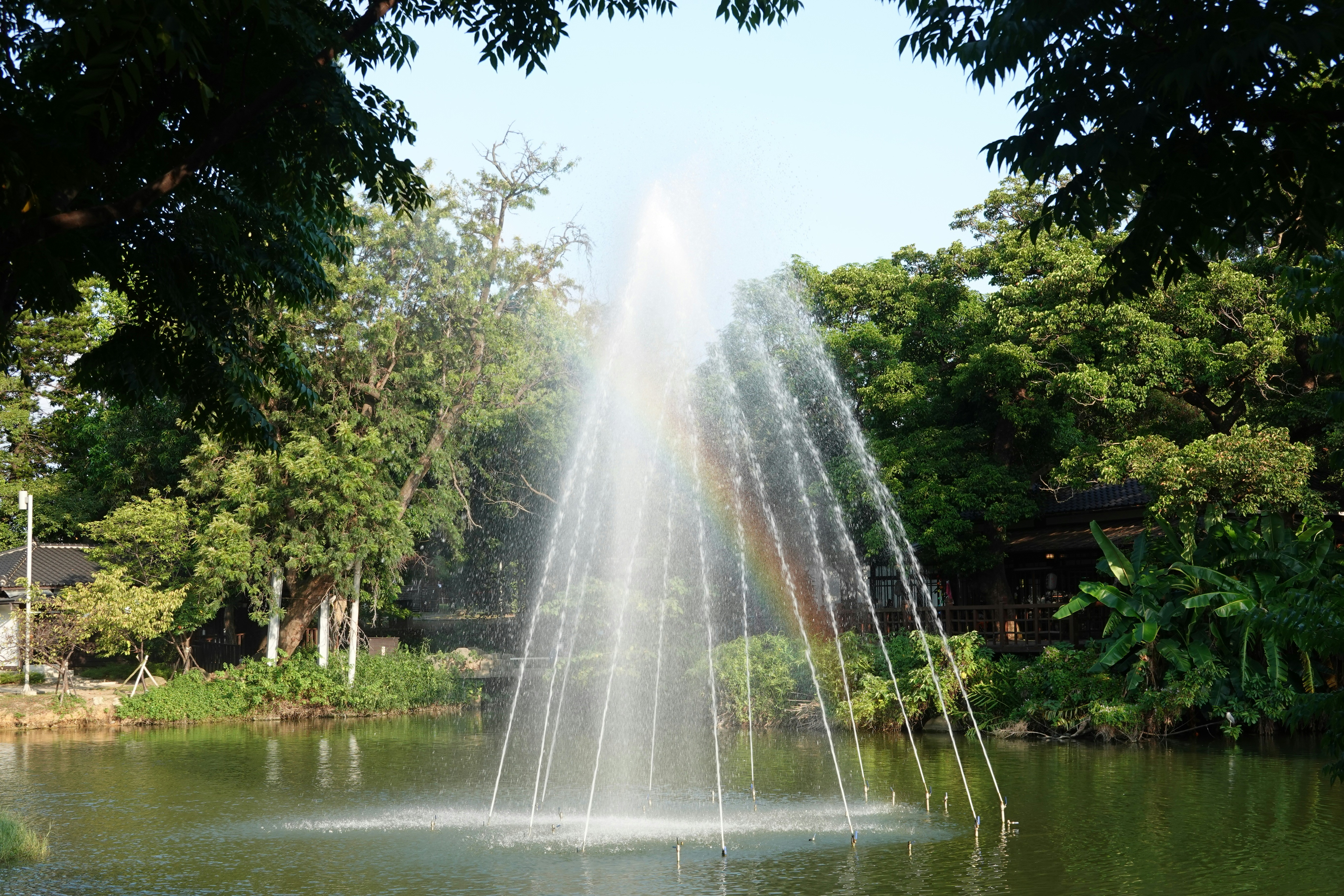 A large fountain spewing water into a pond photo – Free Hsinchu Image ...