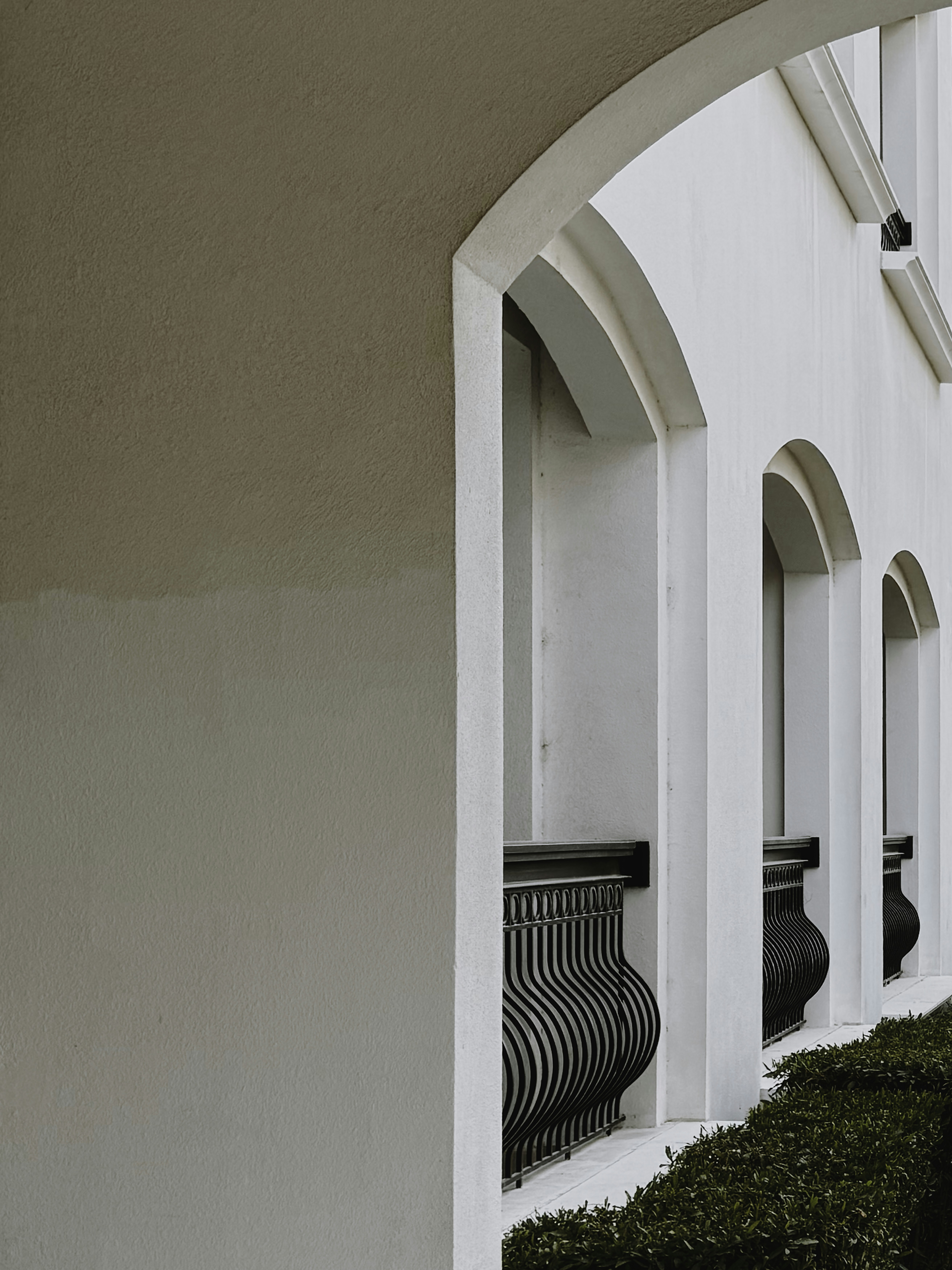 A row of white buildings with black balconies photo – Free Yas island ...
