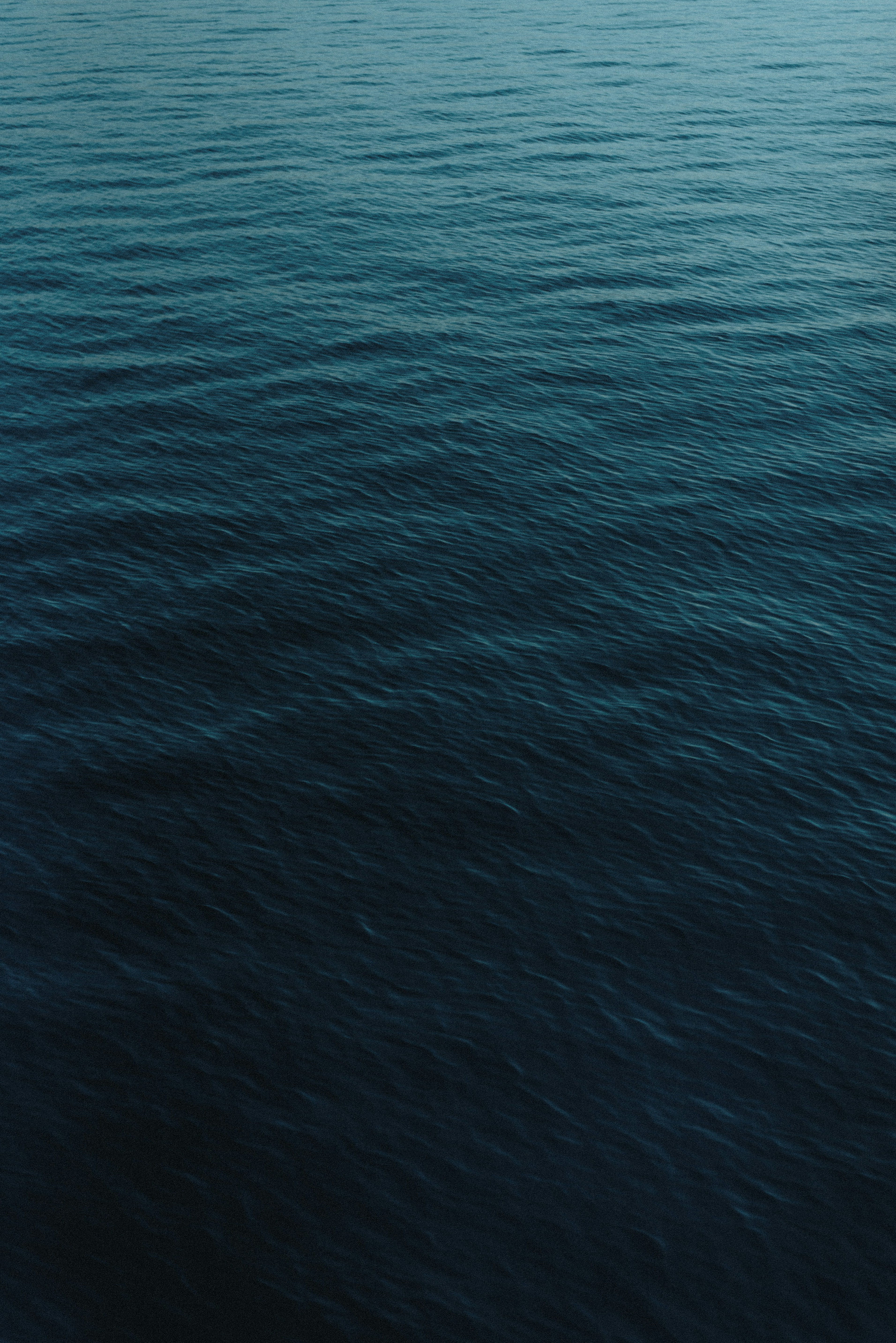 In deep Croatian waters. | a boat floating on top of a large body of water