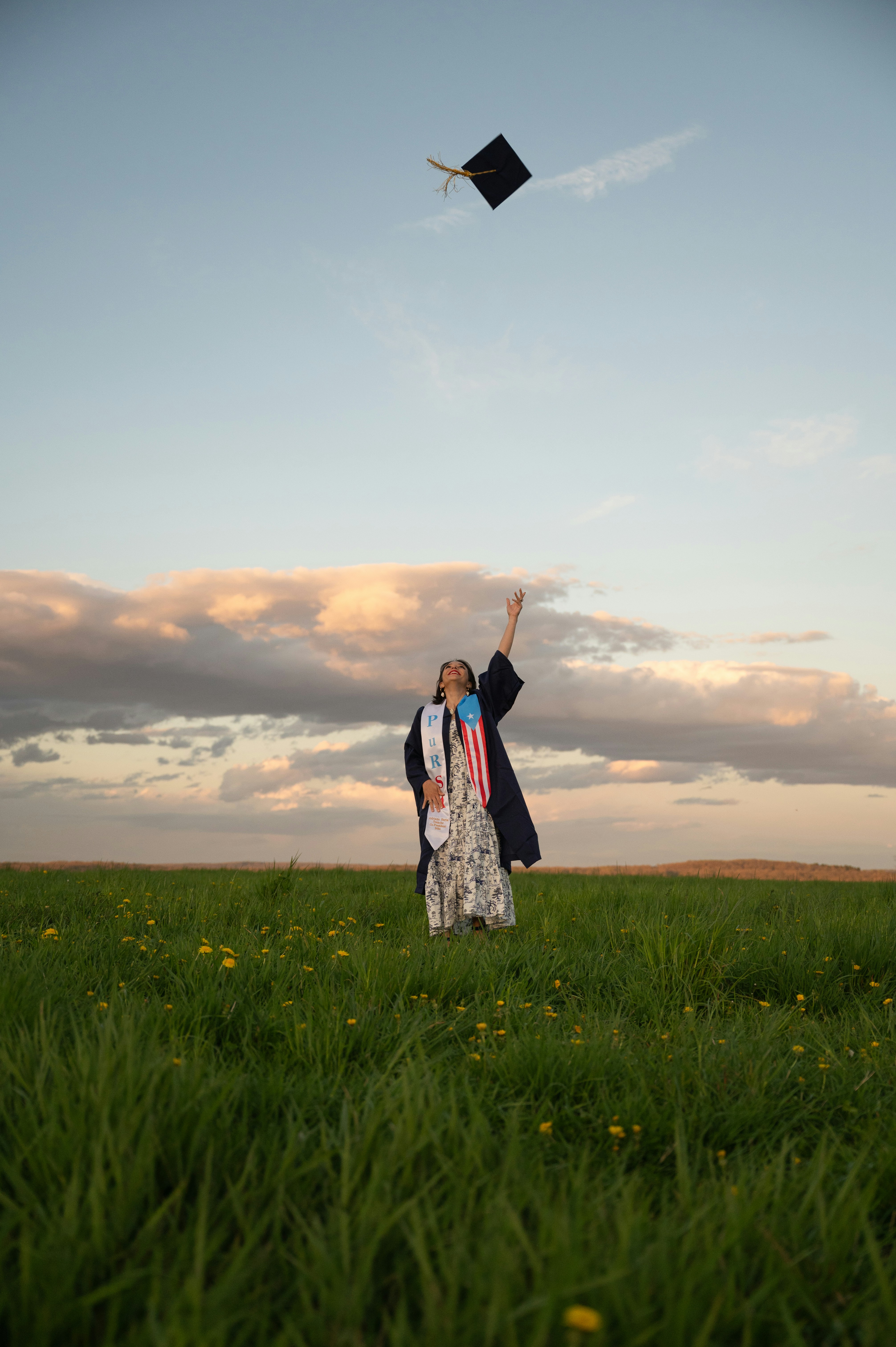 A woman in a graduation gown is flying a kite photo – Free Human Image ...