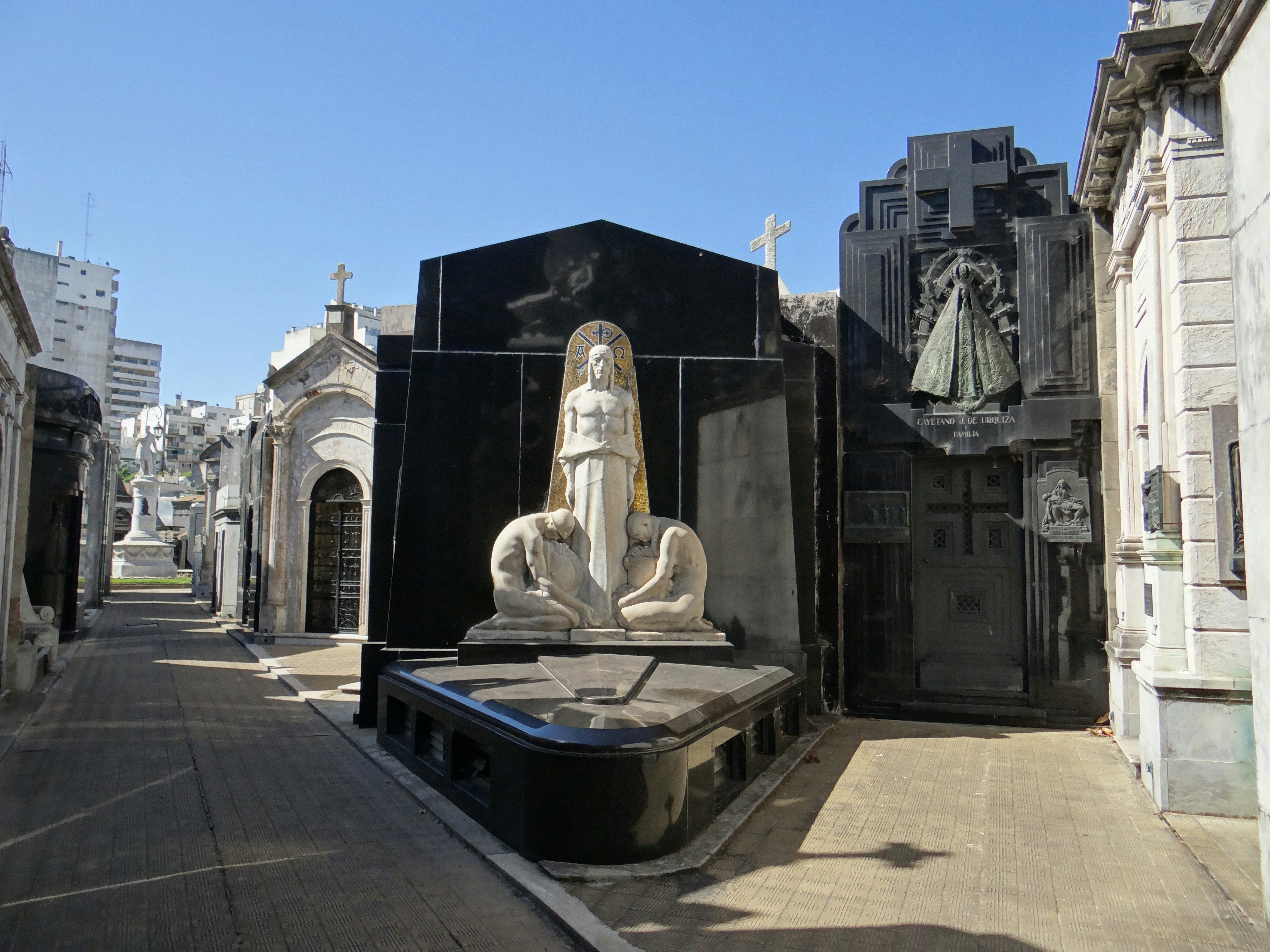Monumental Mausoleum Statuette Amidst Quiet Crypts