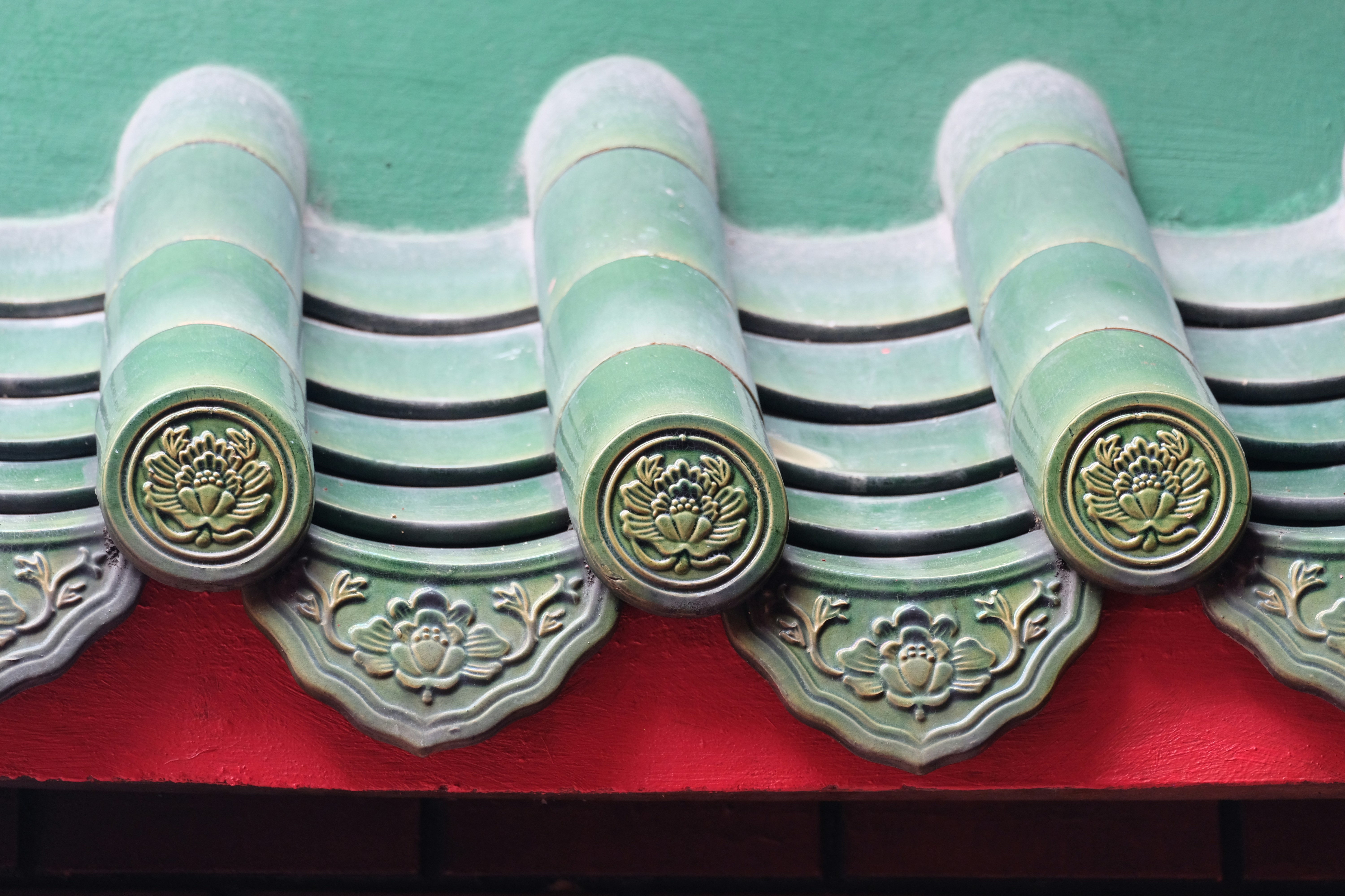 A close up of a row of green roof tiles photo – Free House Image on ...