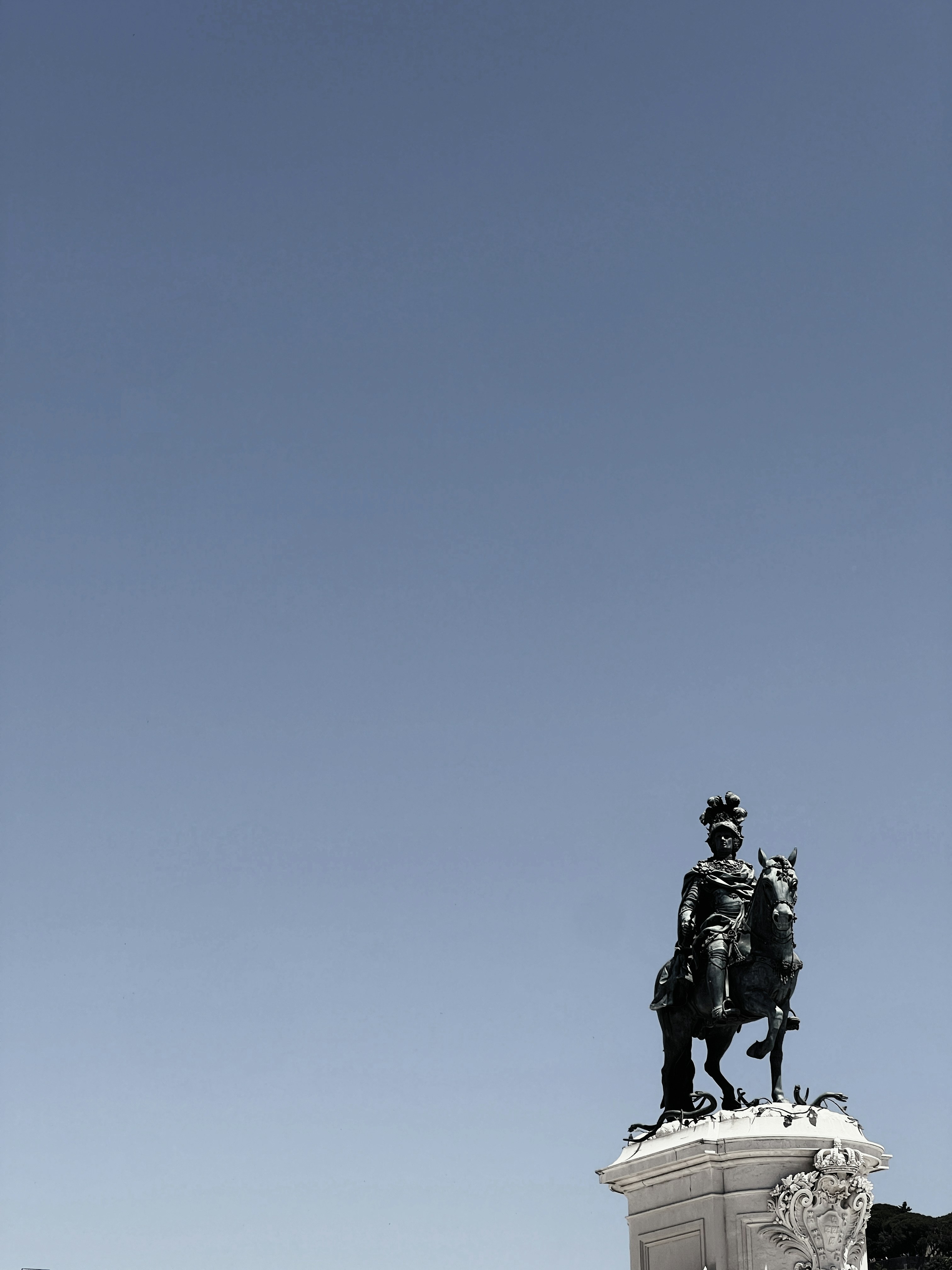 Equestrian statue against a vast blue sky