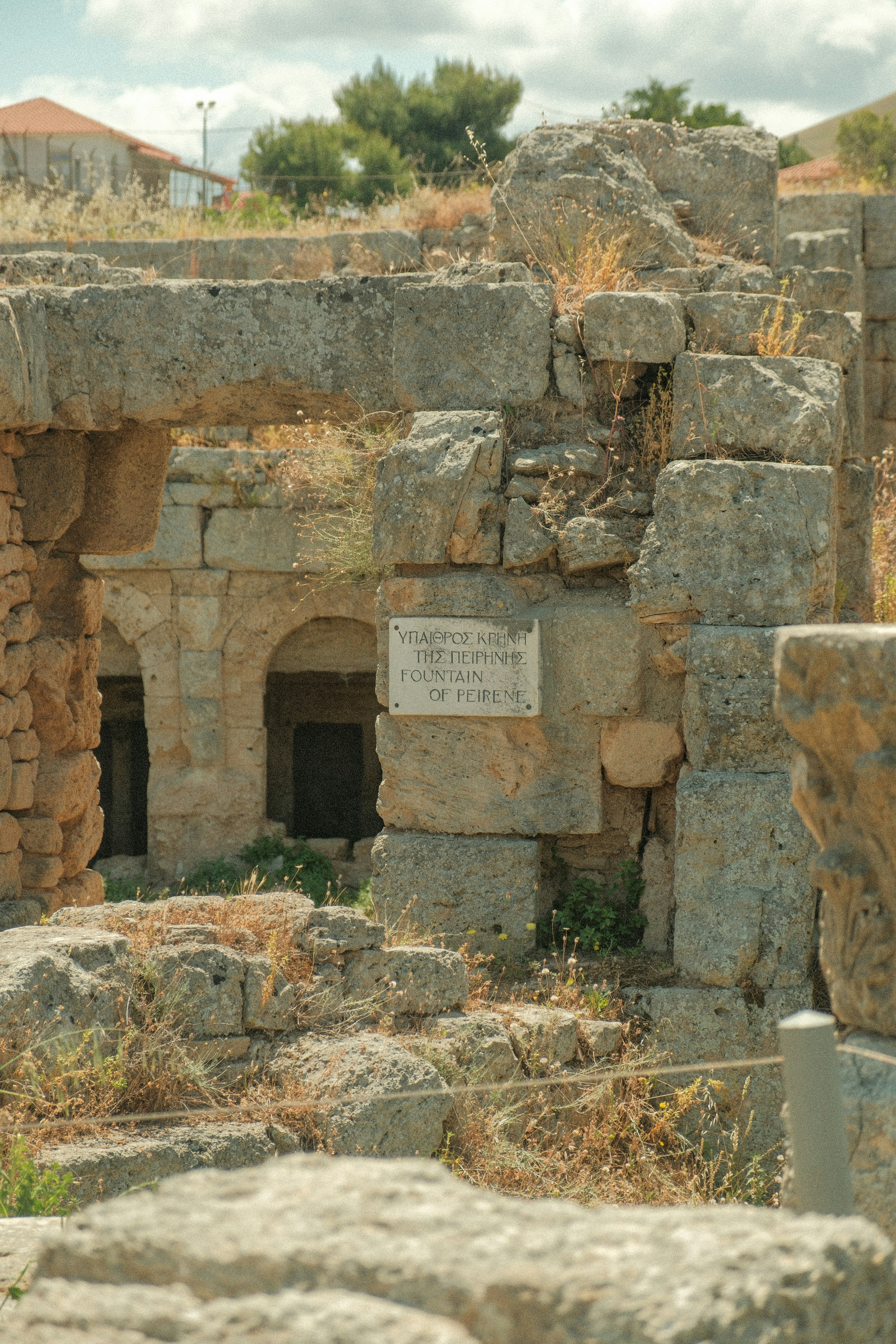 Sunlit Ruins and a Weathered Plaque: Echoes of an Ancient Fountain