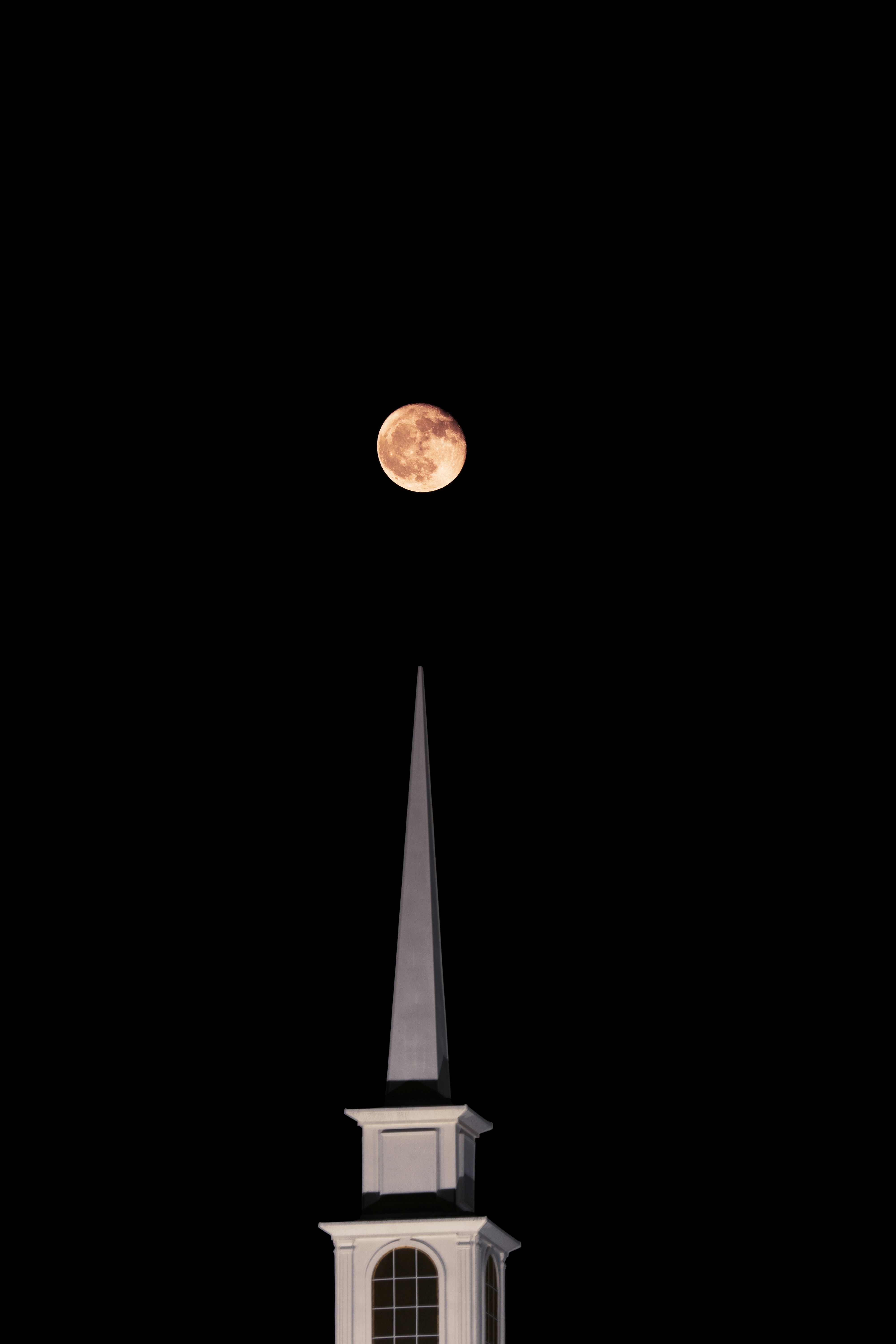 A church steeple with a full moon in the background photo – Free ...