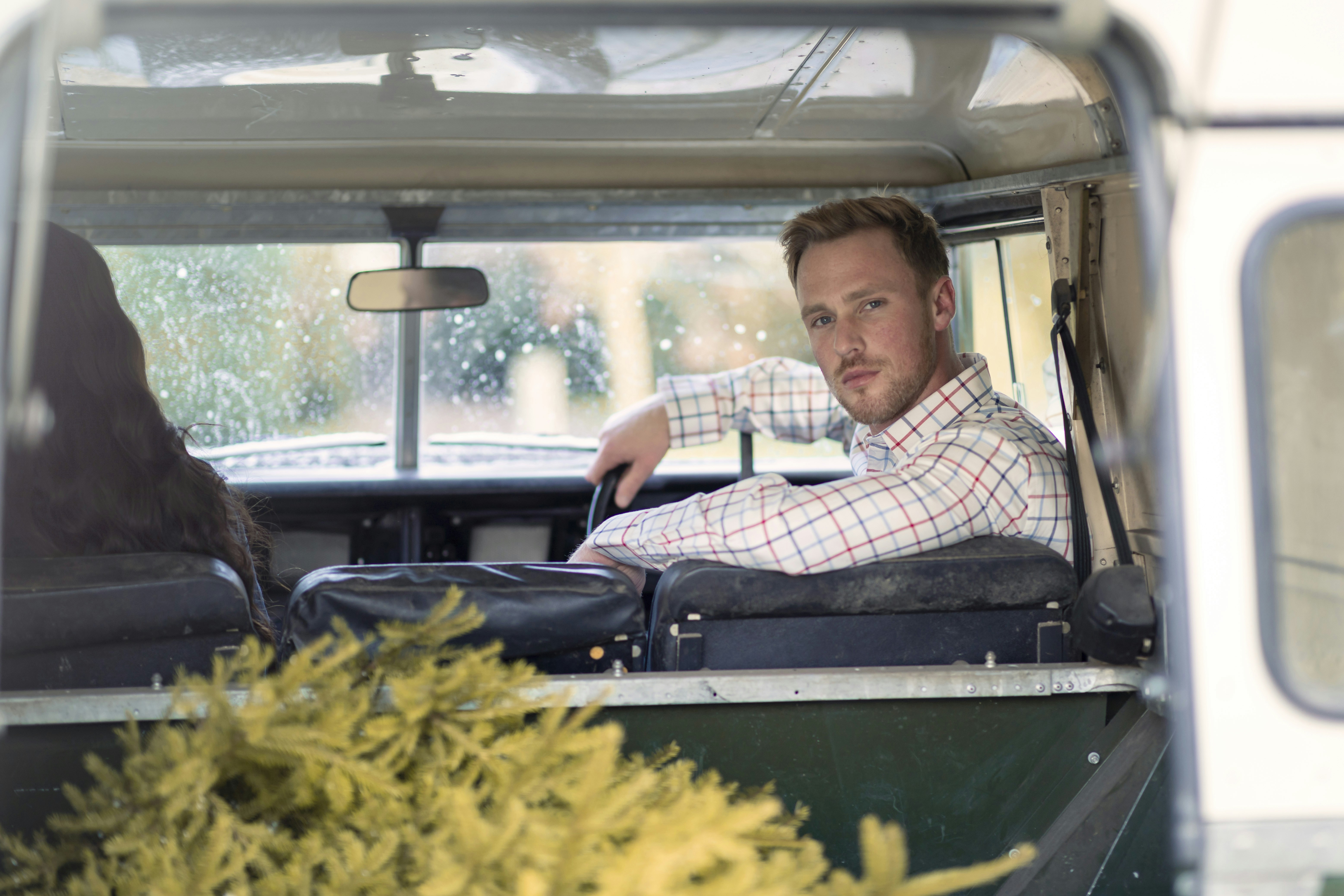 Gaze Through the Back Window: A Quiet Moment in a Vintage Car