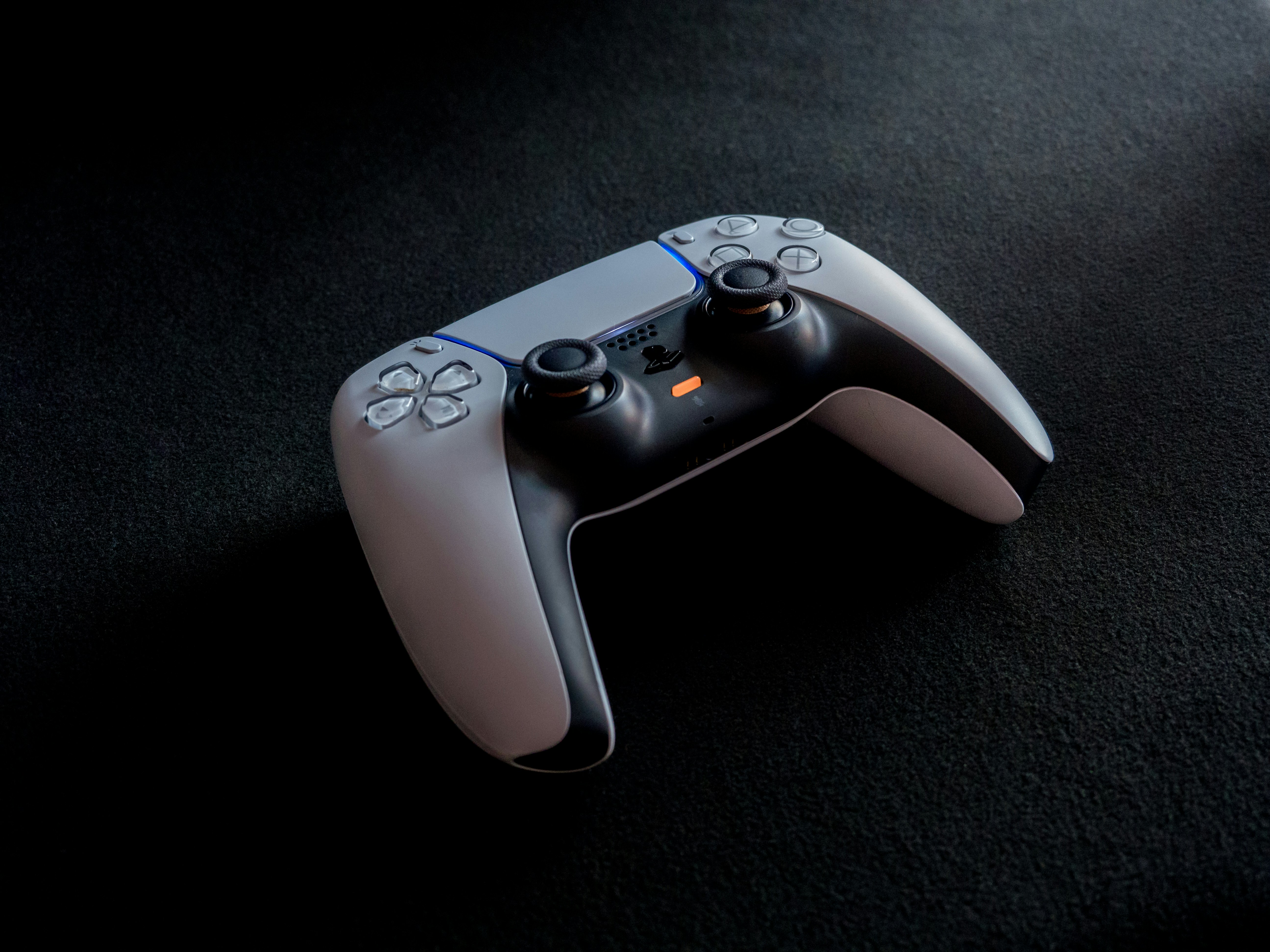 A close up of a video game controller photo – Free Grey Image on Unsplash