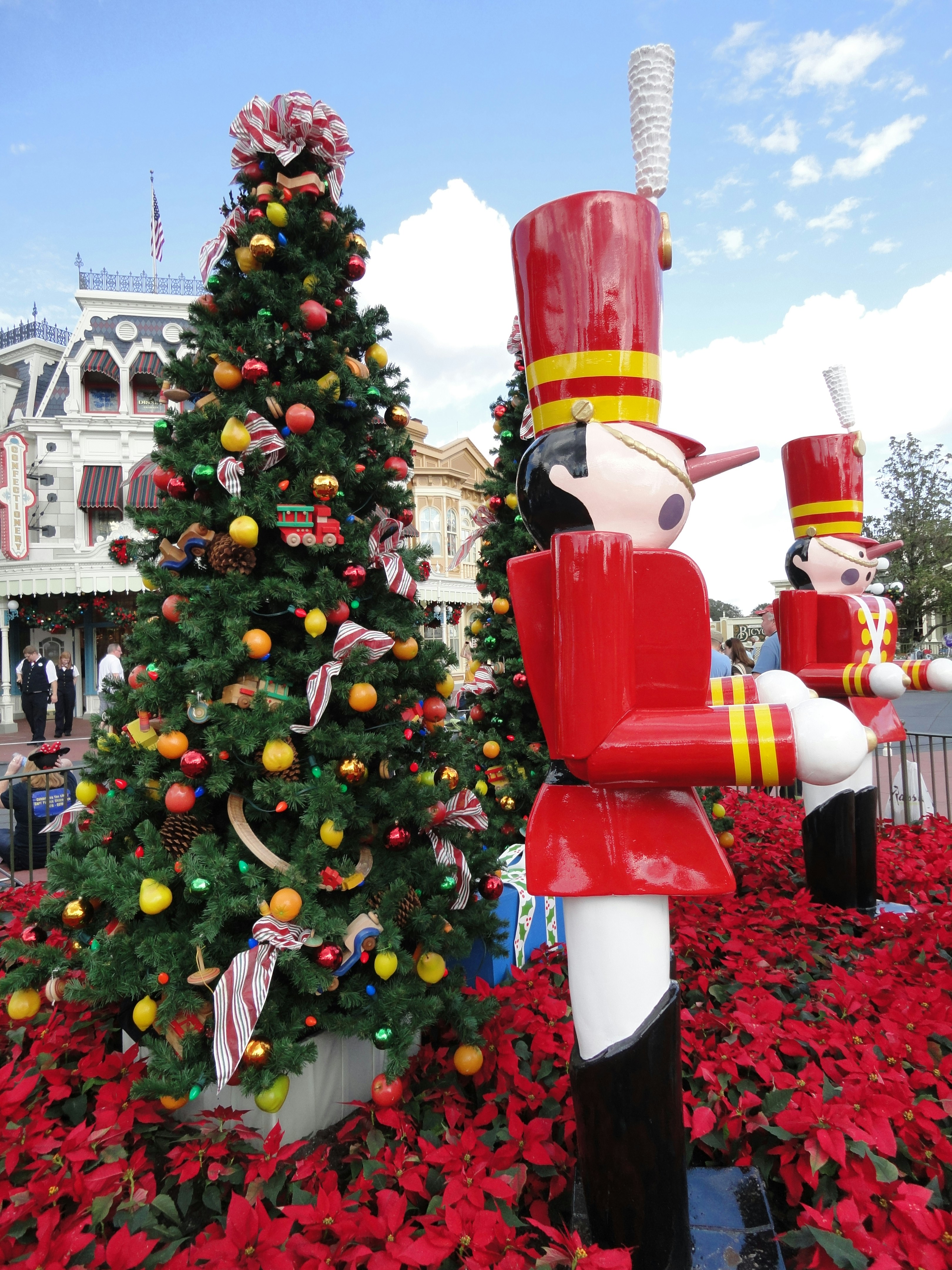 Candy-Crowned Christmas Parade: Nutcracker Guards Beside a Glowing Tree