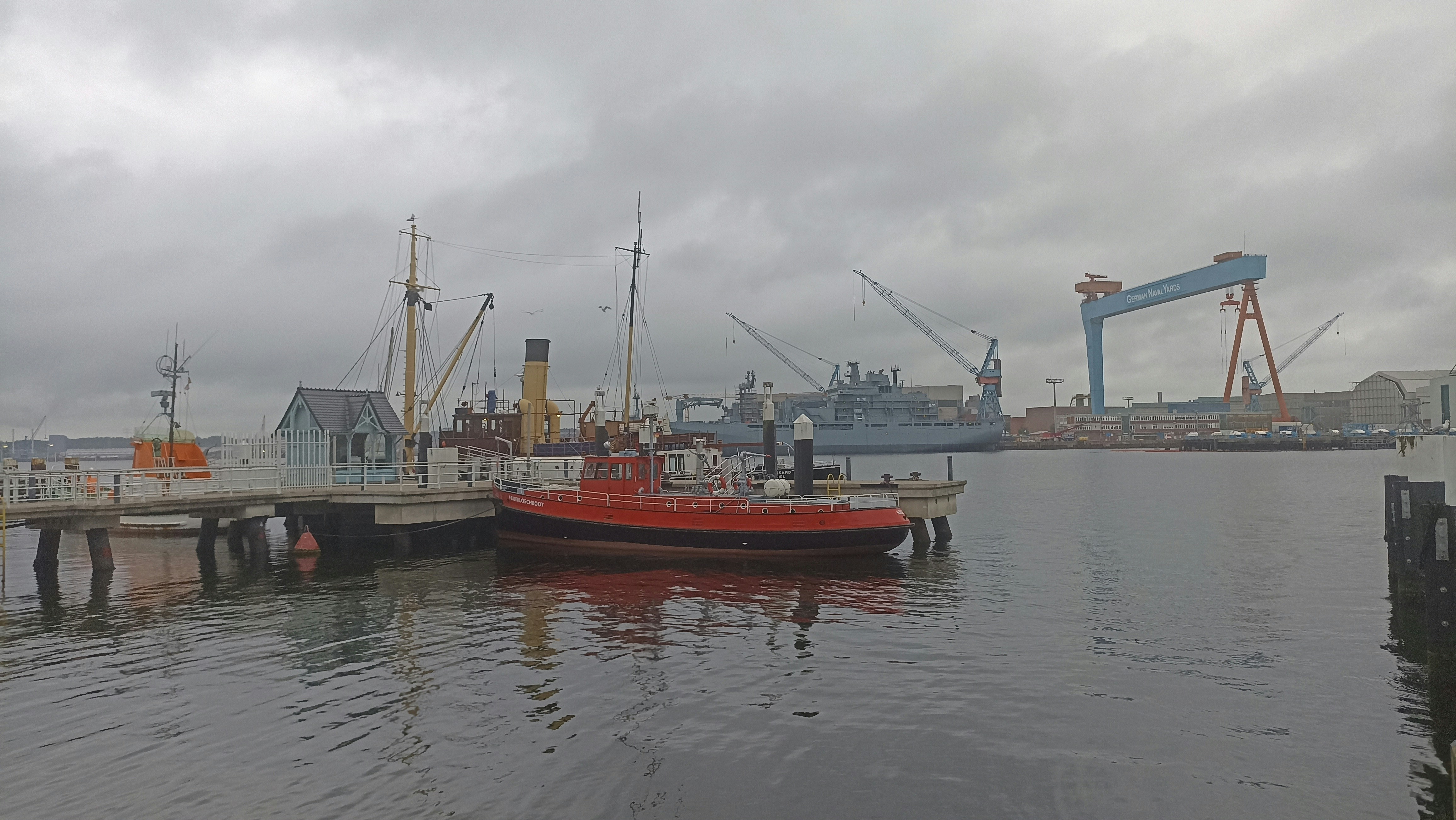 A red and white boat docked at a dock photo – Free Kiel Image on Unsplash