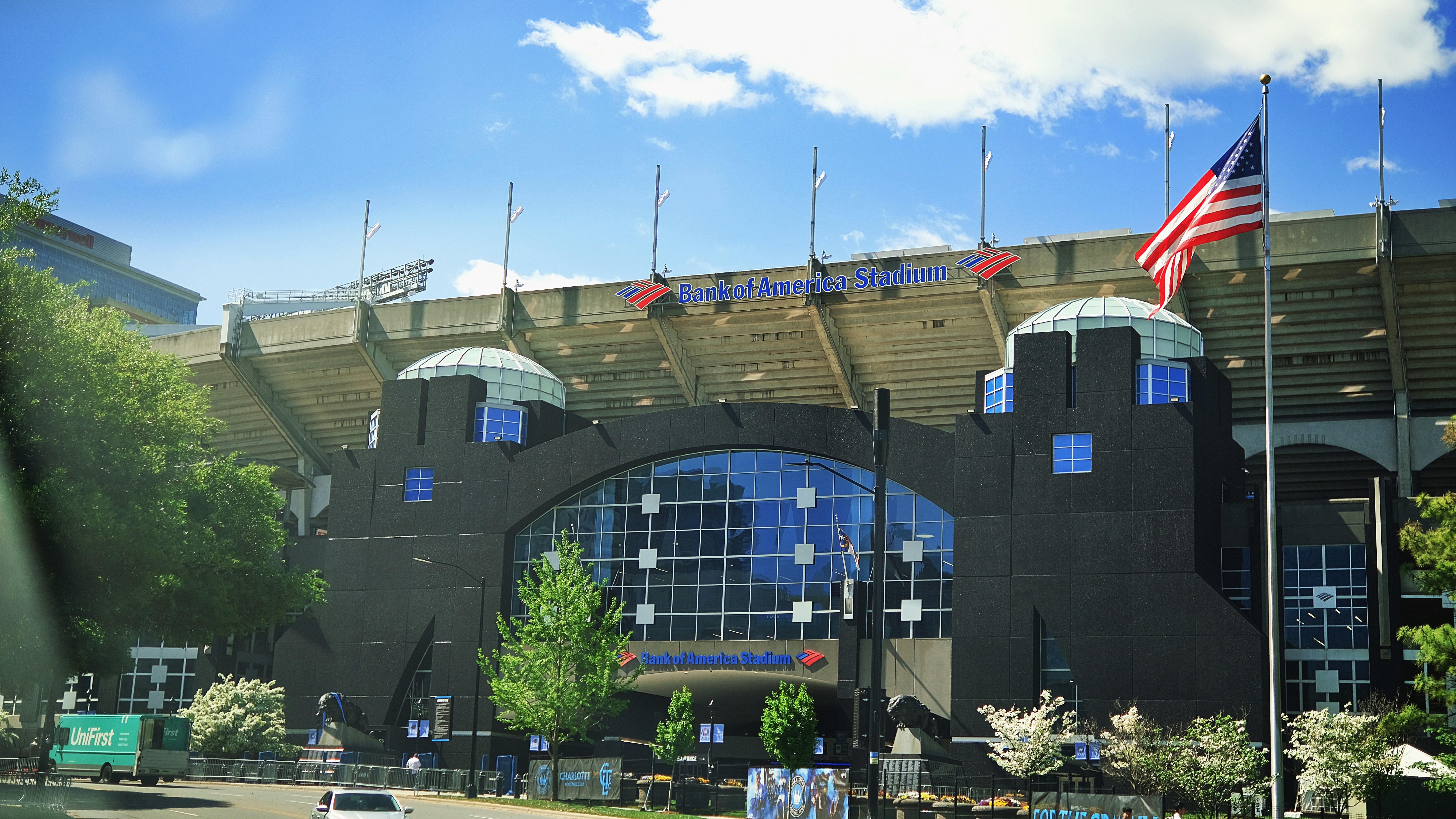A large building with an american flag on top of it photo – Free East w ...