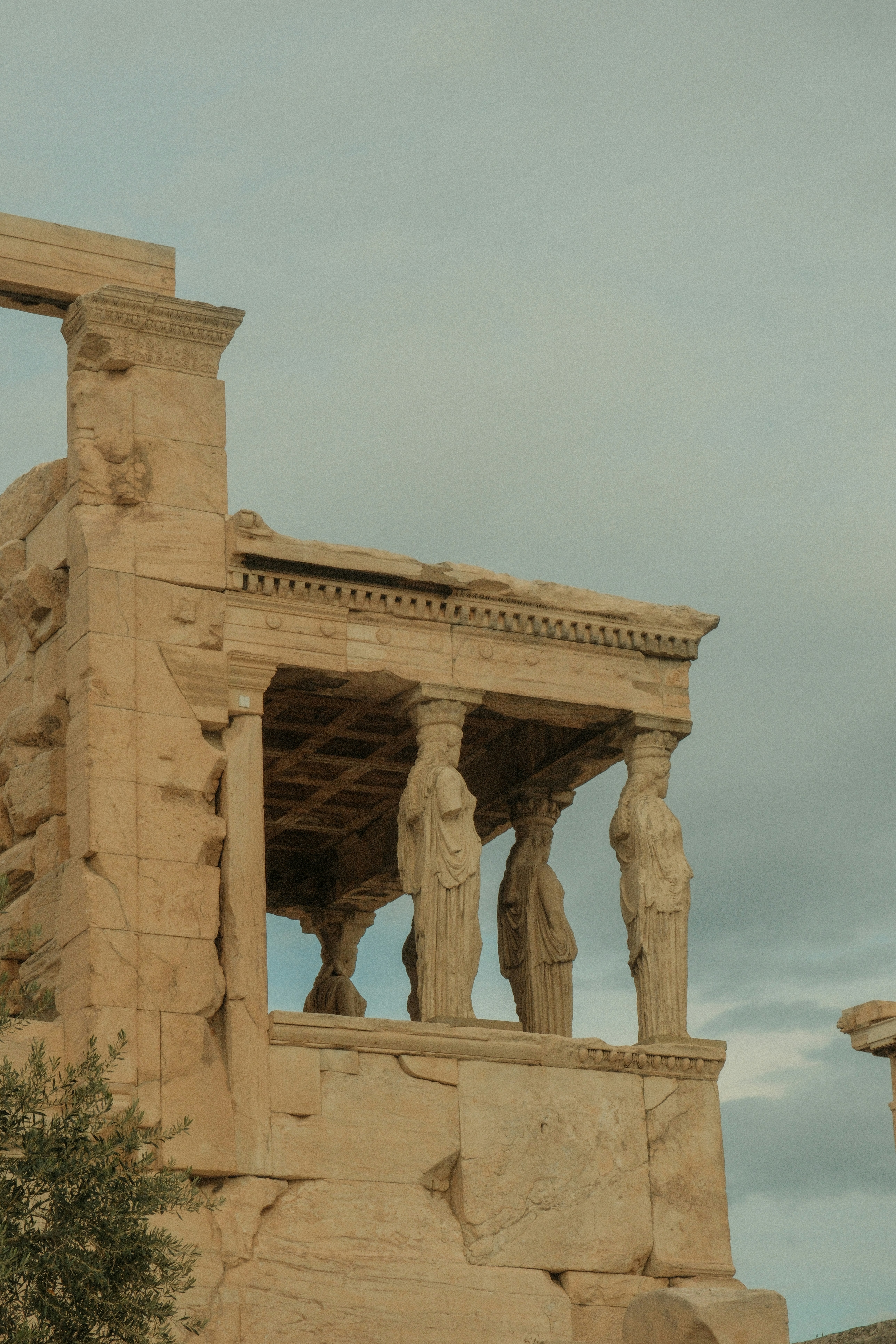 A large stone structure with statues on top of it photo – Free Greece ...
