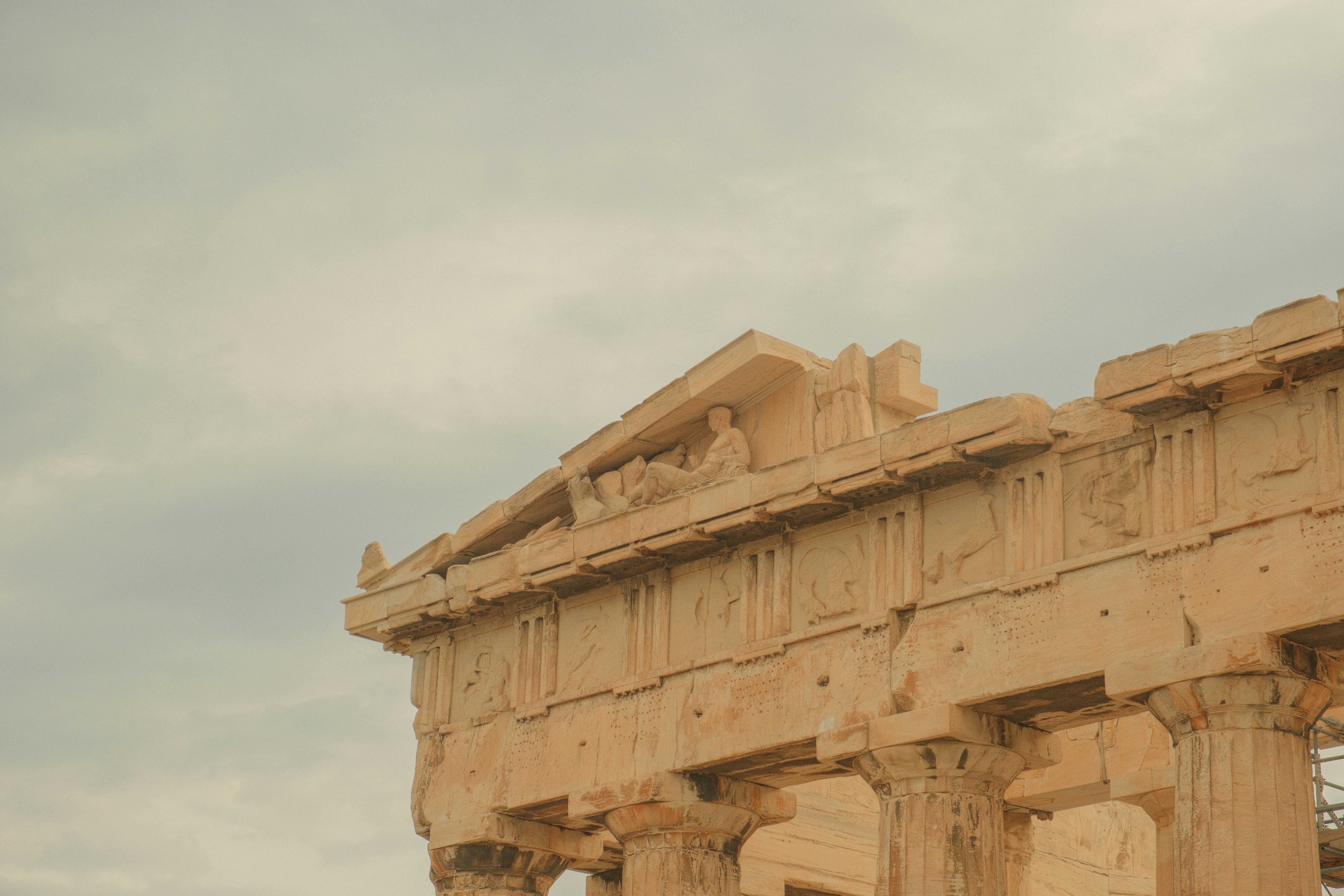 A large stone structure with carvings on the side of it photo – Free ...