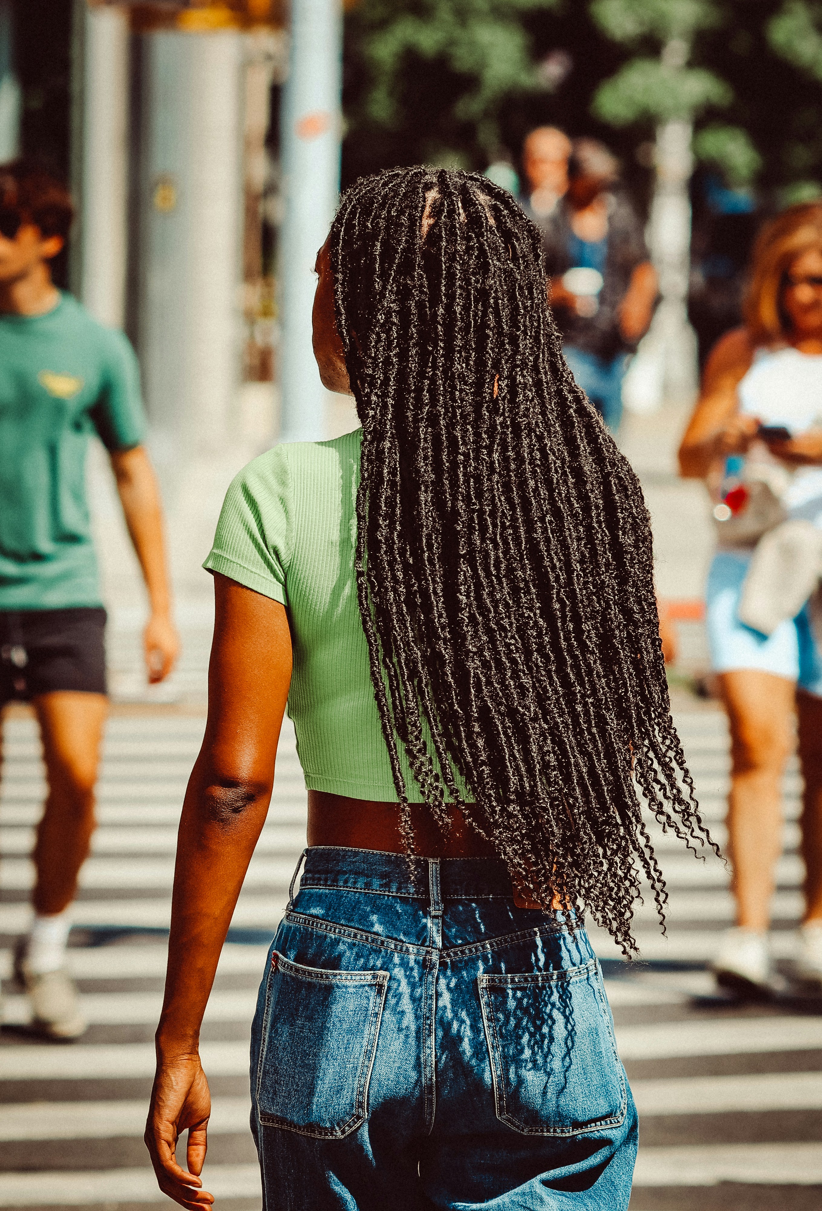 Crosswalk Reverie: Dreadlocks in the City Light
