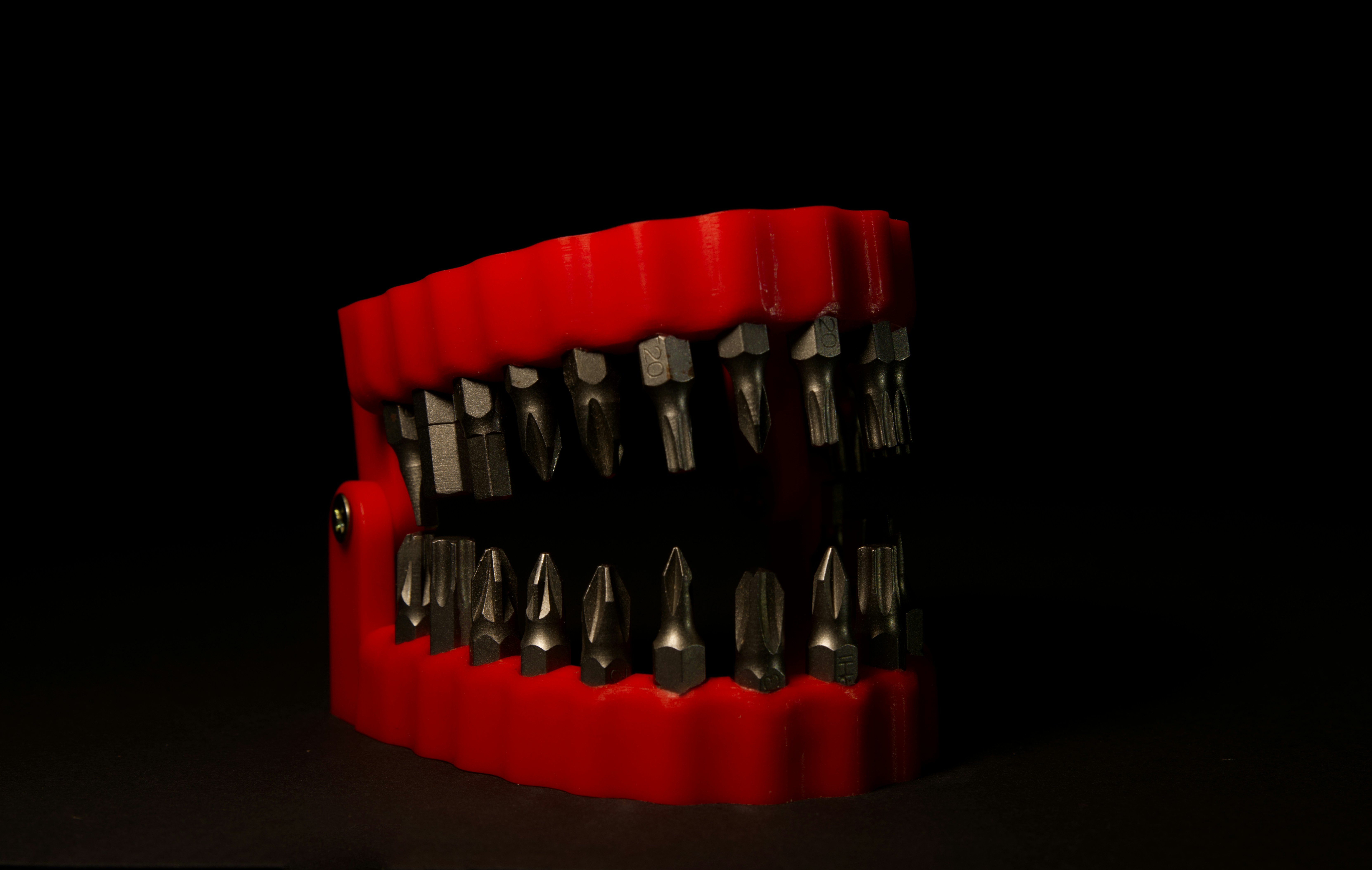 A close up of a set of screws in the shape of a mouth photo – Free ...