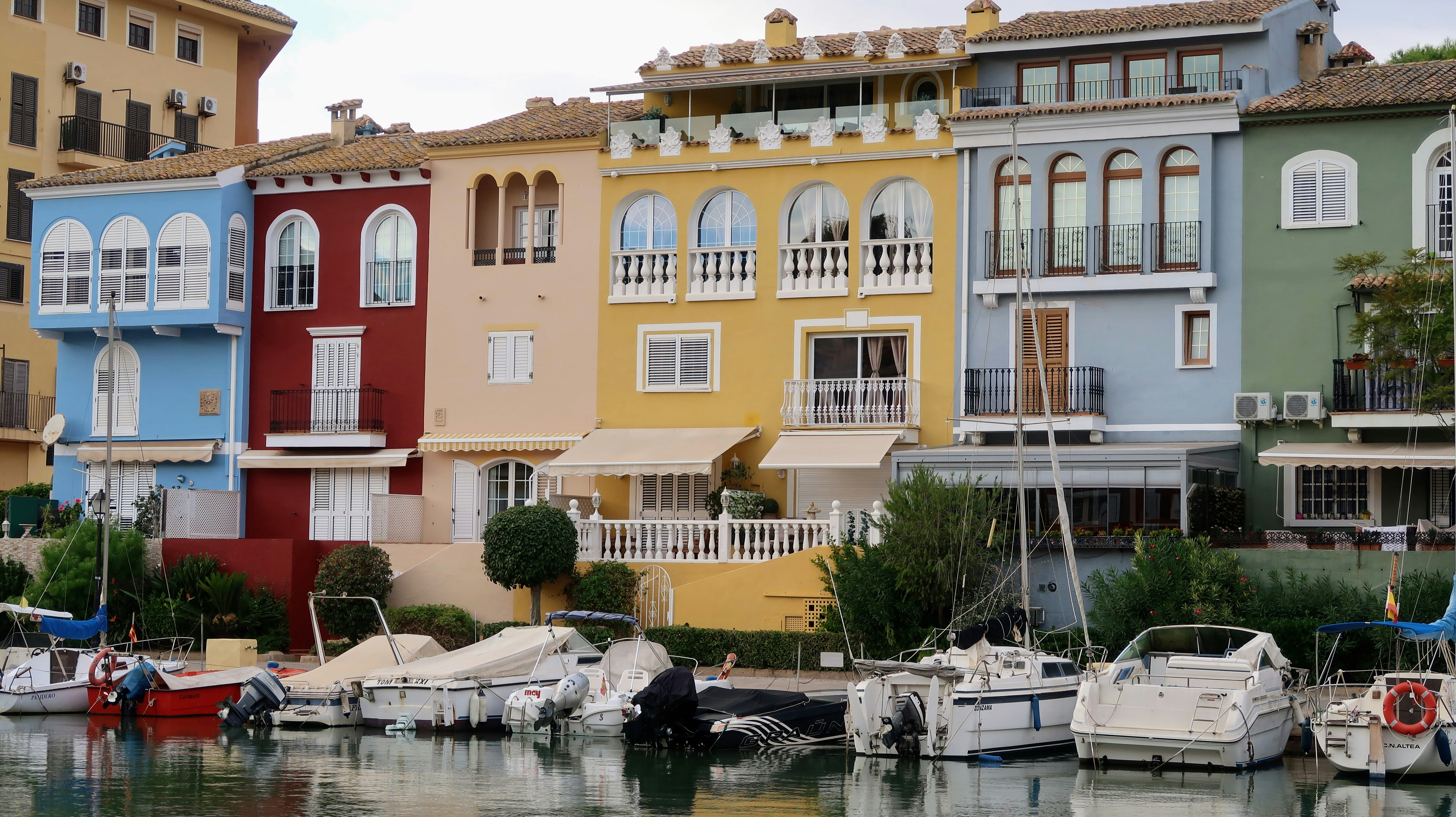 Pastel Harbor Row: A Quiet Corridor of Boats and Colorful Townhouses