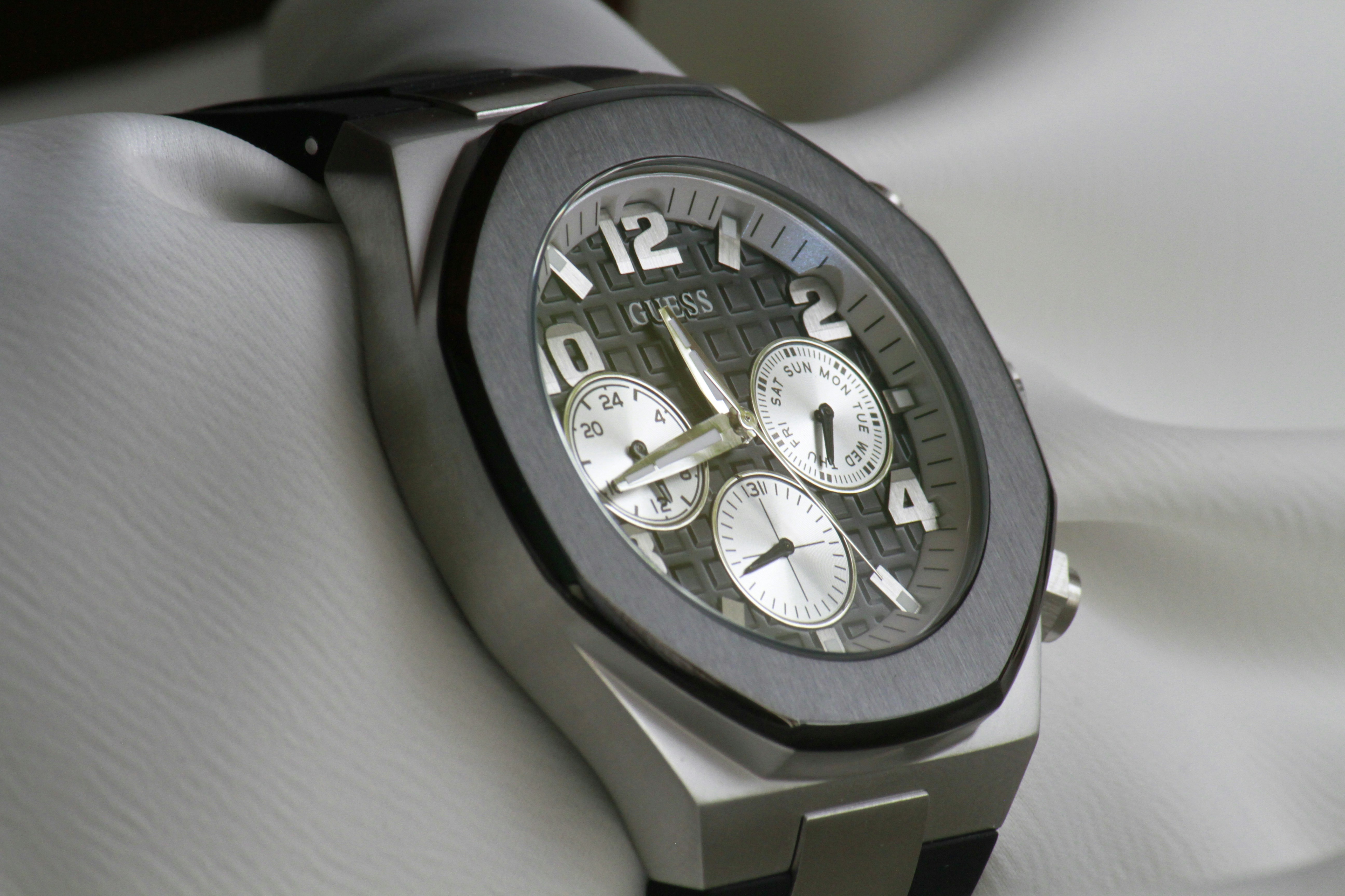 Dialed In: Close-Up of a Guess Chronograph Resting on Satin