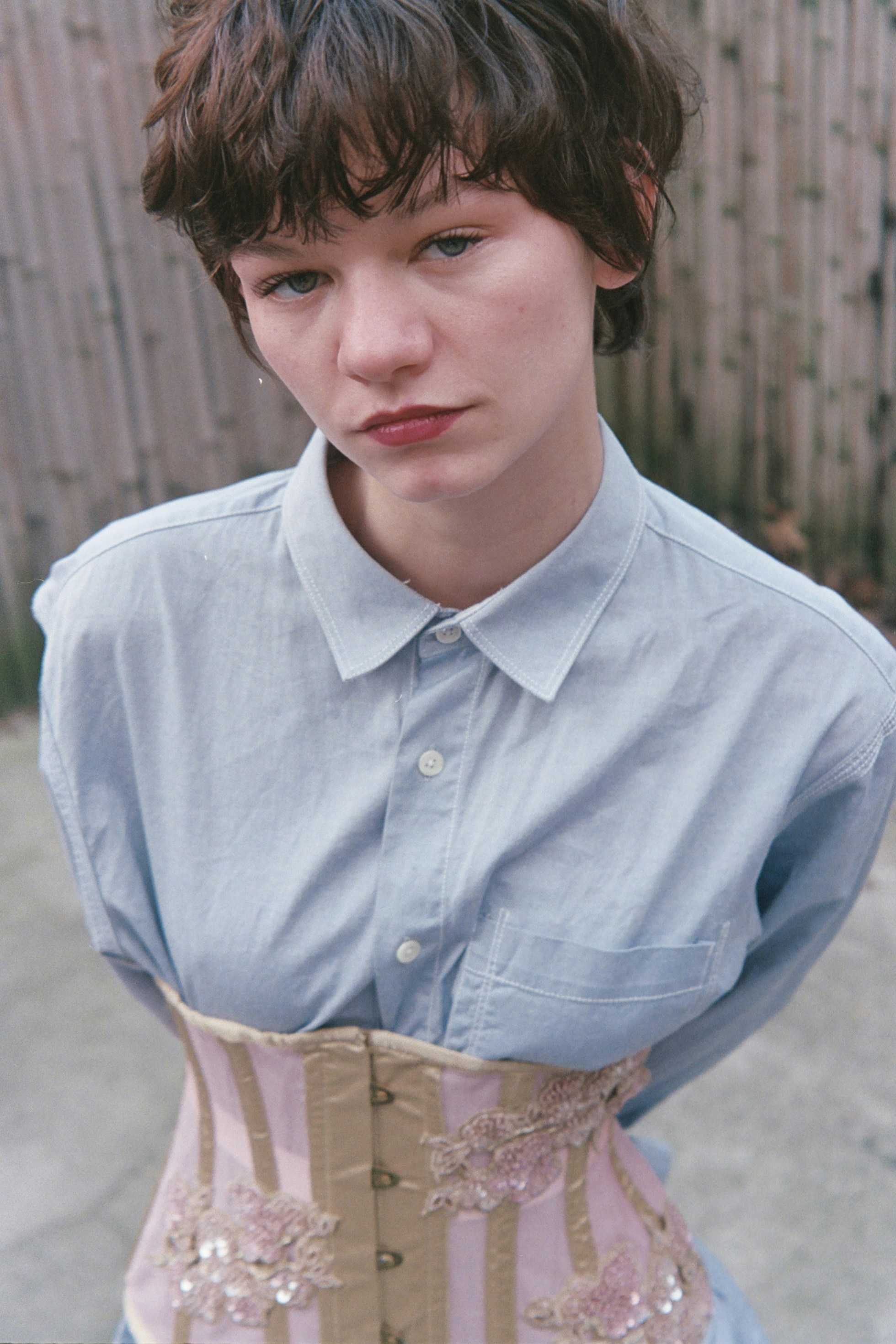 A woman in a corset is posing for a picture photo – Free Portrait Image ...
