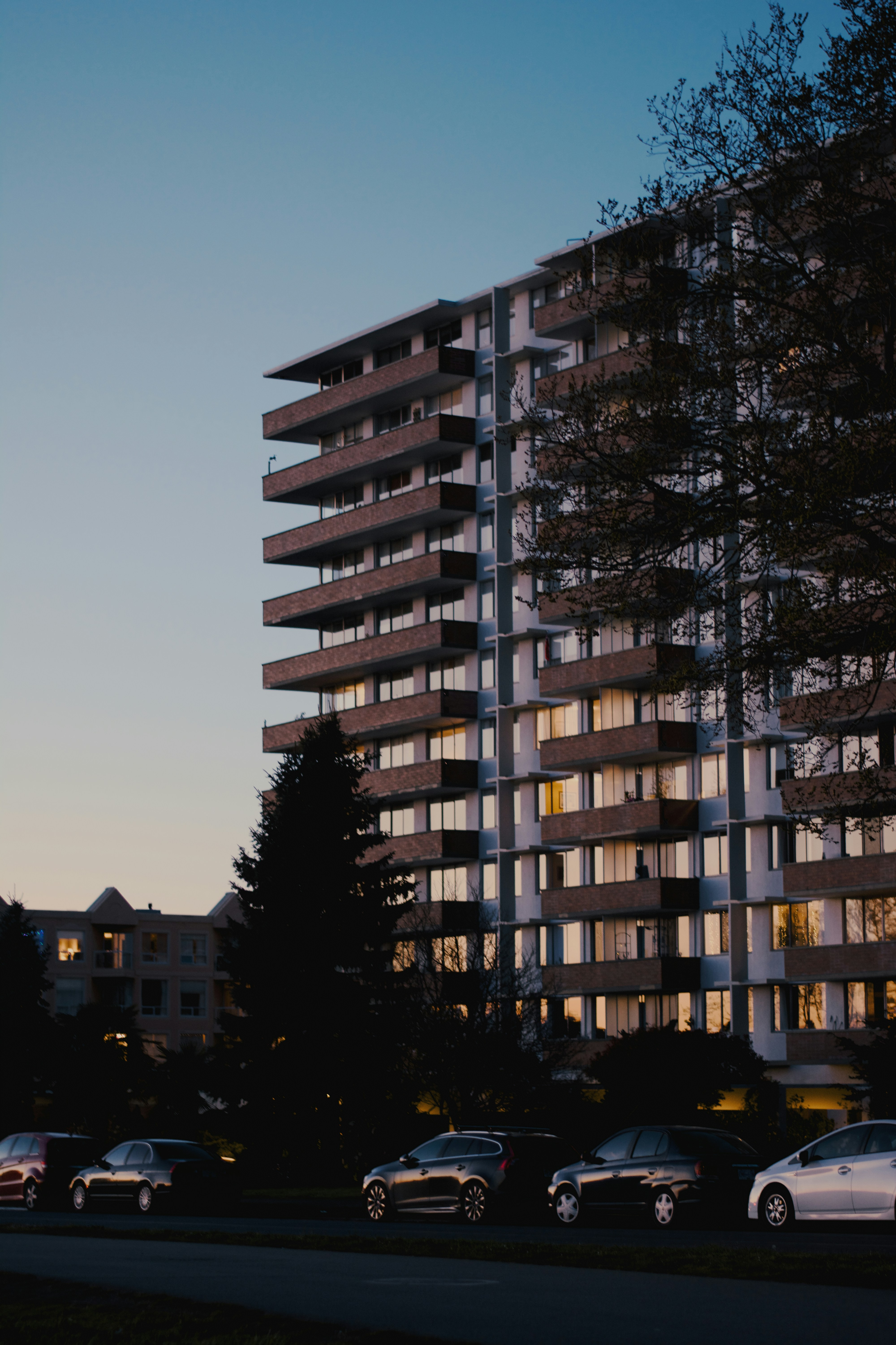 Evening Glow Along a Brick-Clad Apartment Tower
