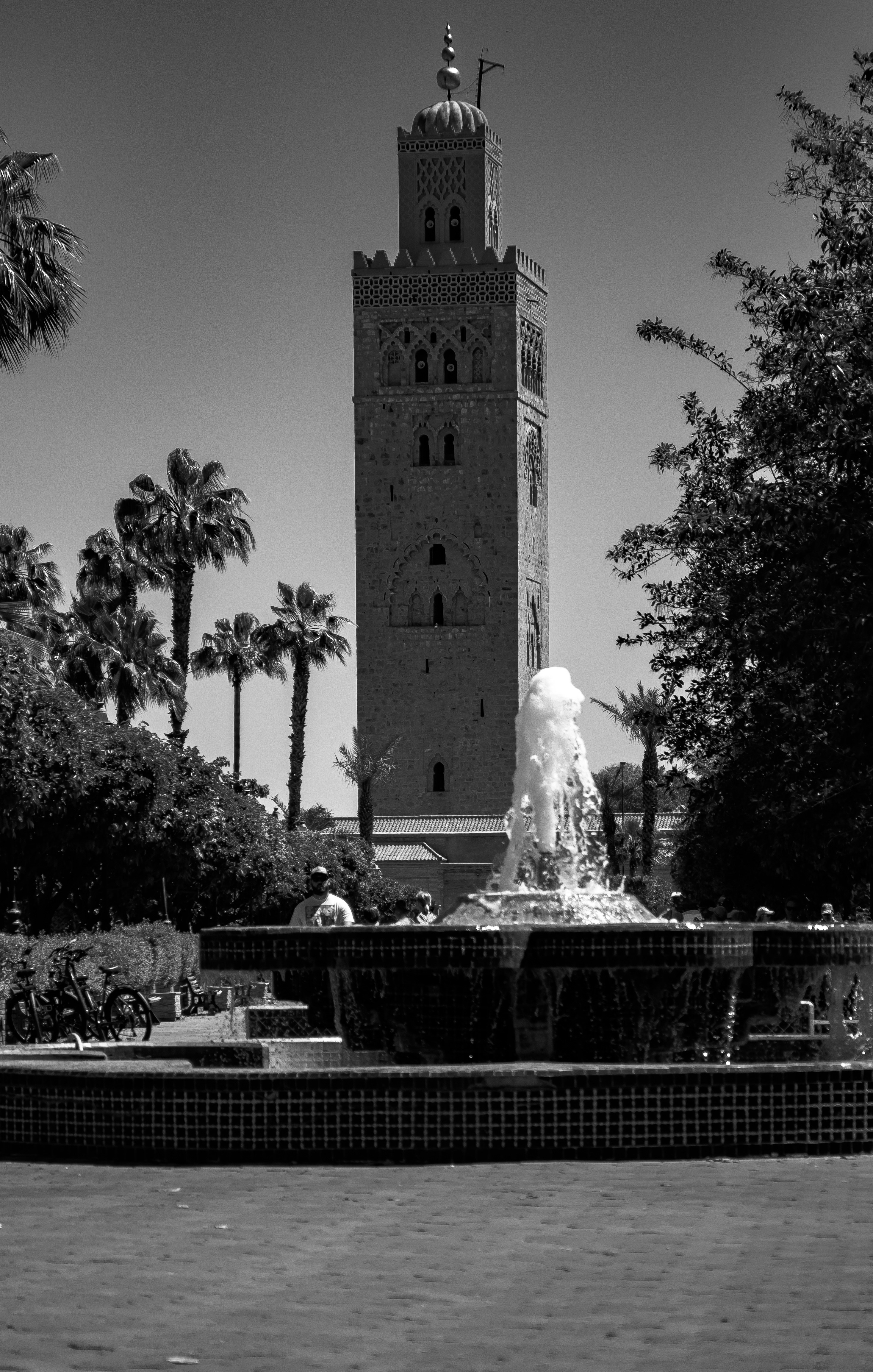 Monochrome Majesty: The Koutoubia Minaret Framed by a Quiet Fountain