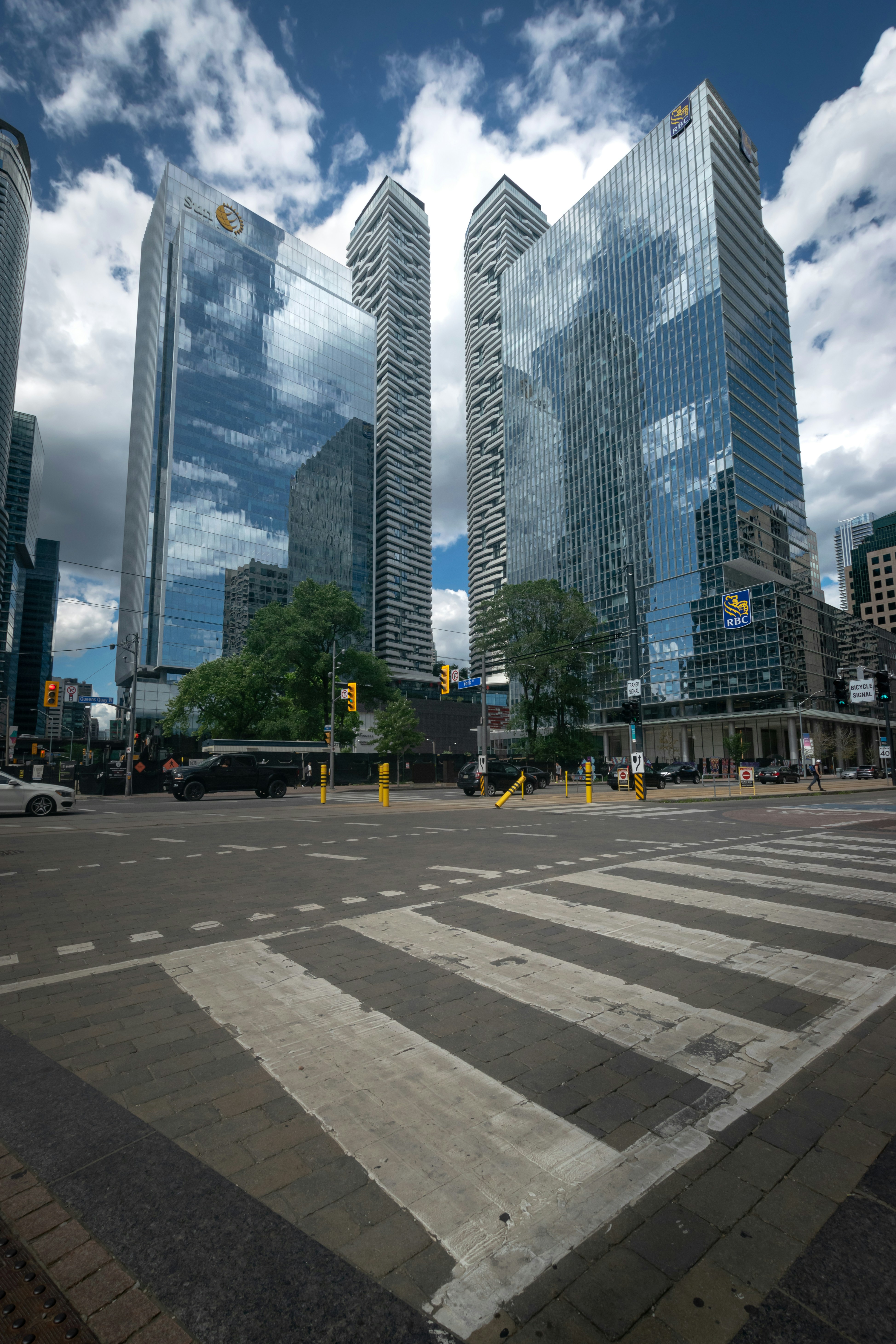 Walking along Toronto Harbourfront on a blue sky with clouds day. Toronto, Canada, Jul/22.