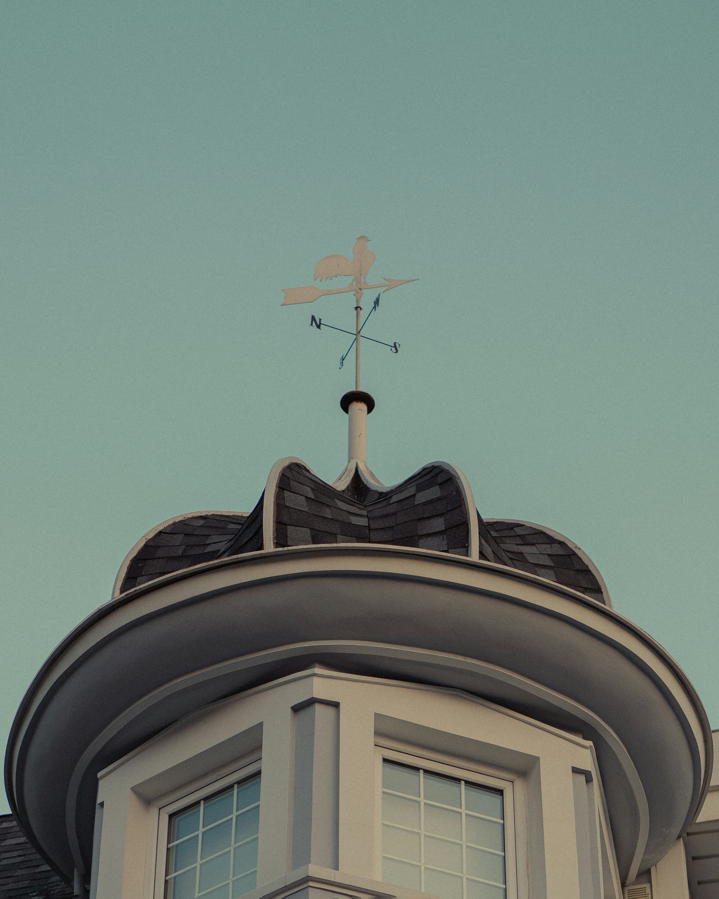 Weather Vane on a Whimsical Roof Peak