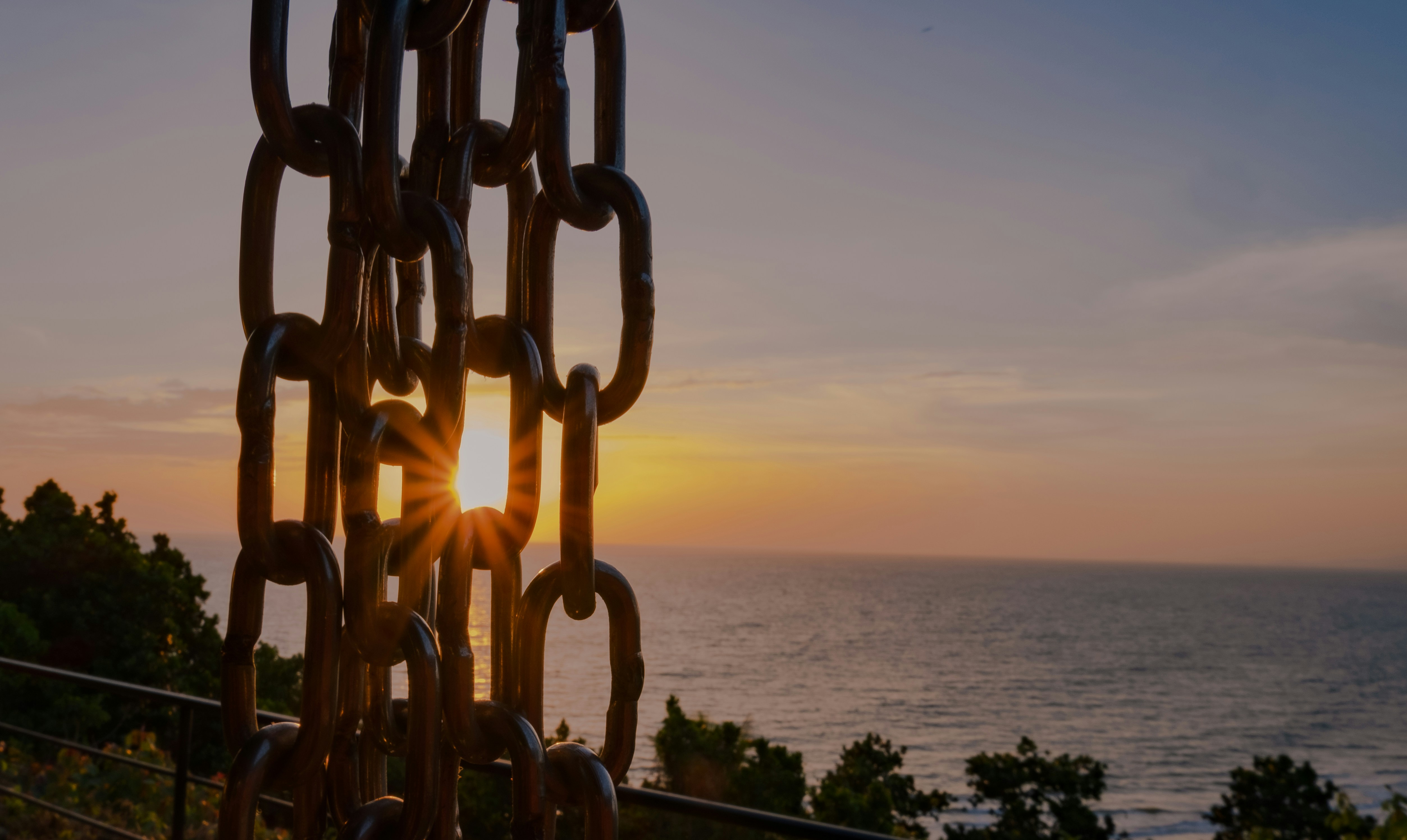 Sunlit Chains at Dusk Over a Quiet Sea