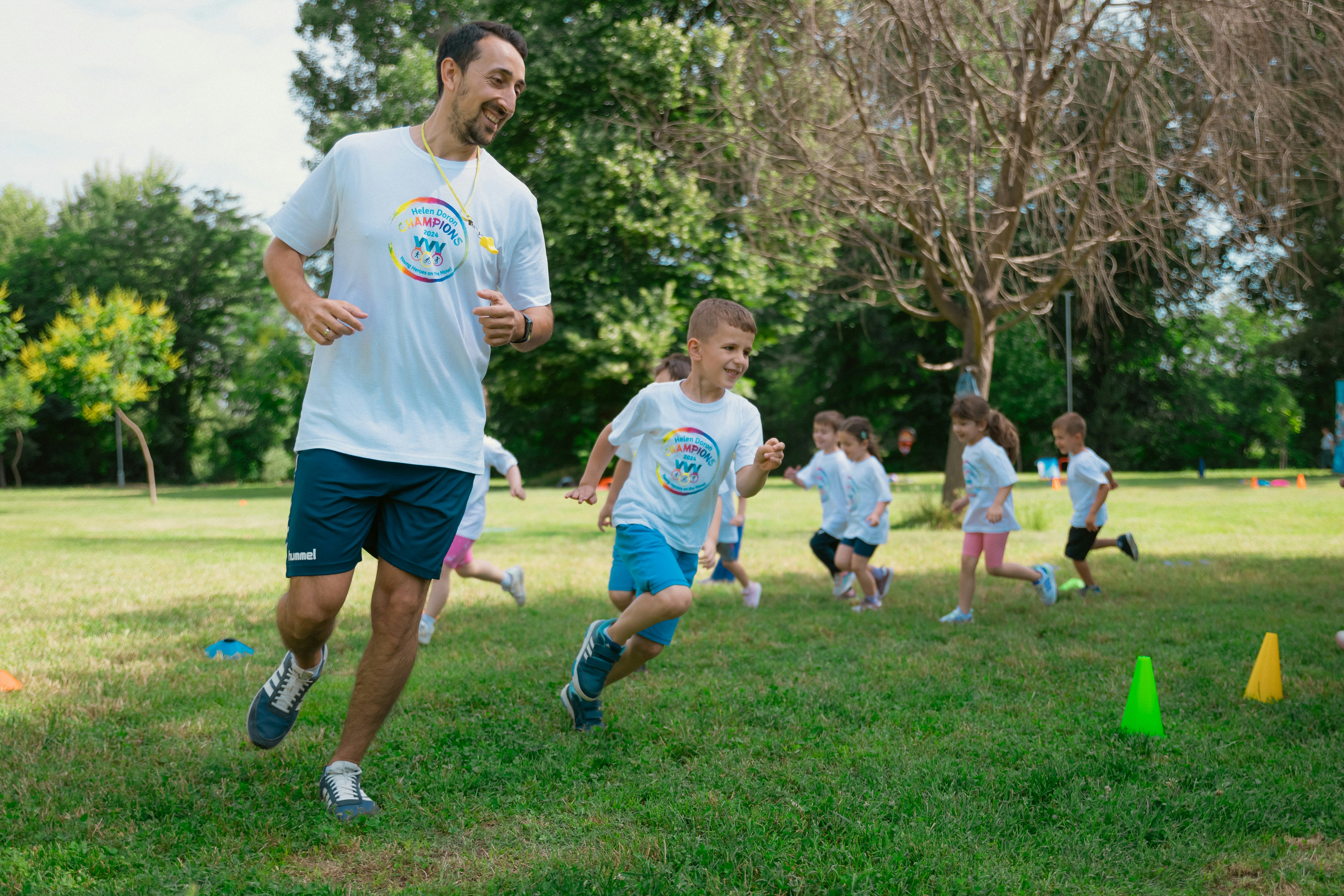 A group of people running around a field photo – Free Man Image on Unsplash
