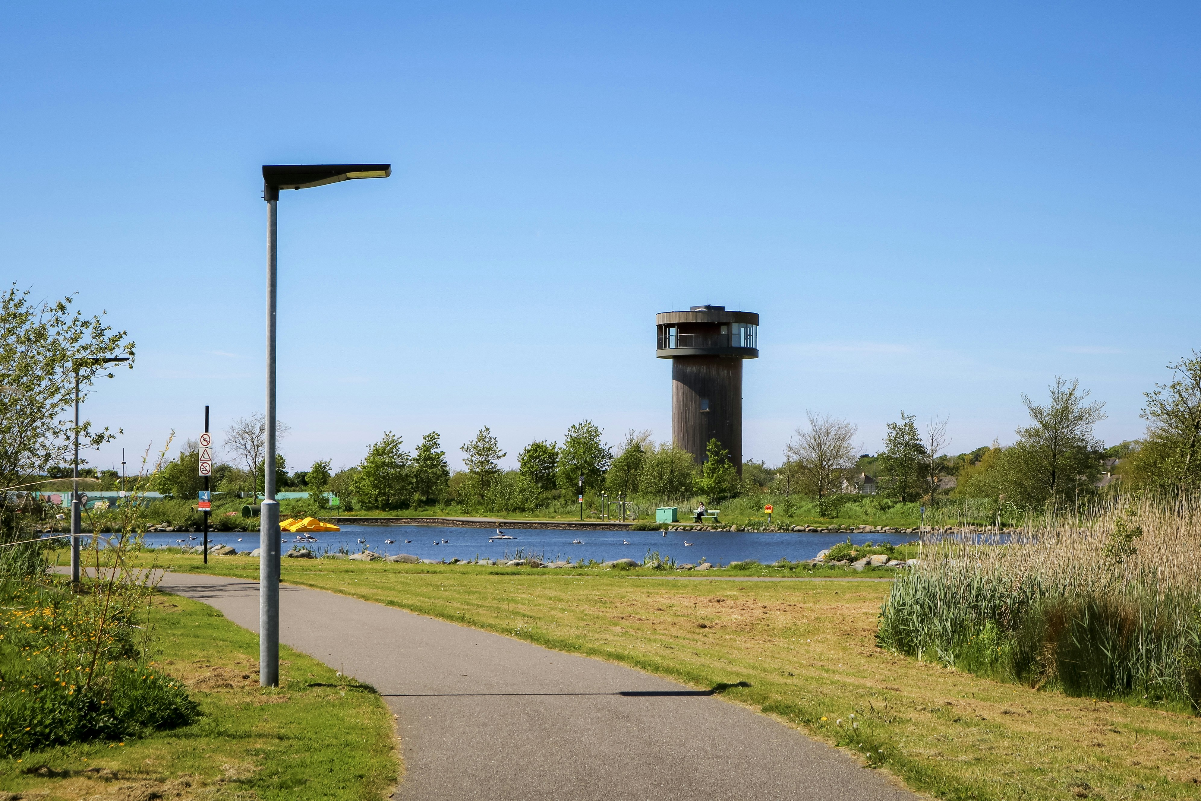 Quiet Riverscape with Towering Utility Structure