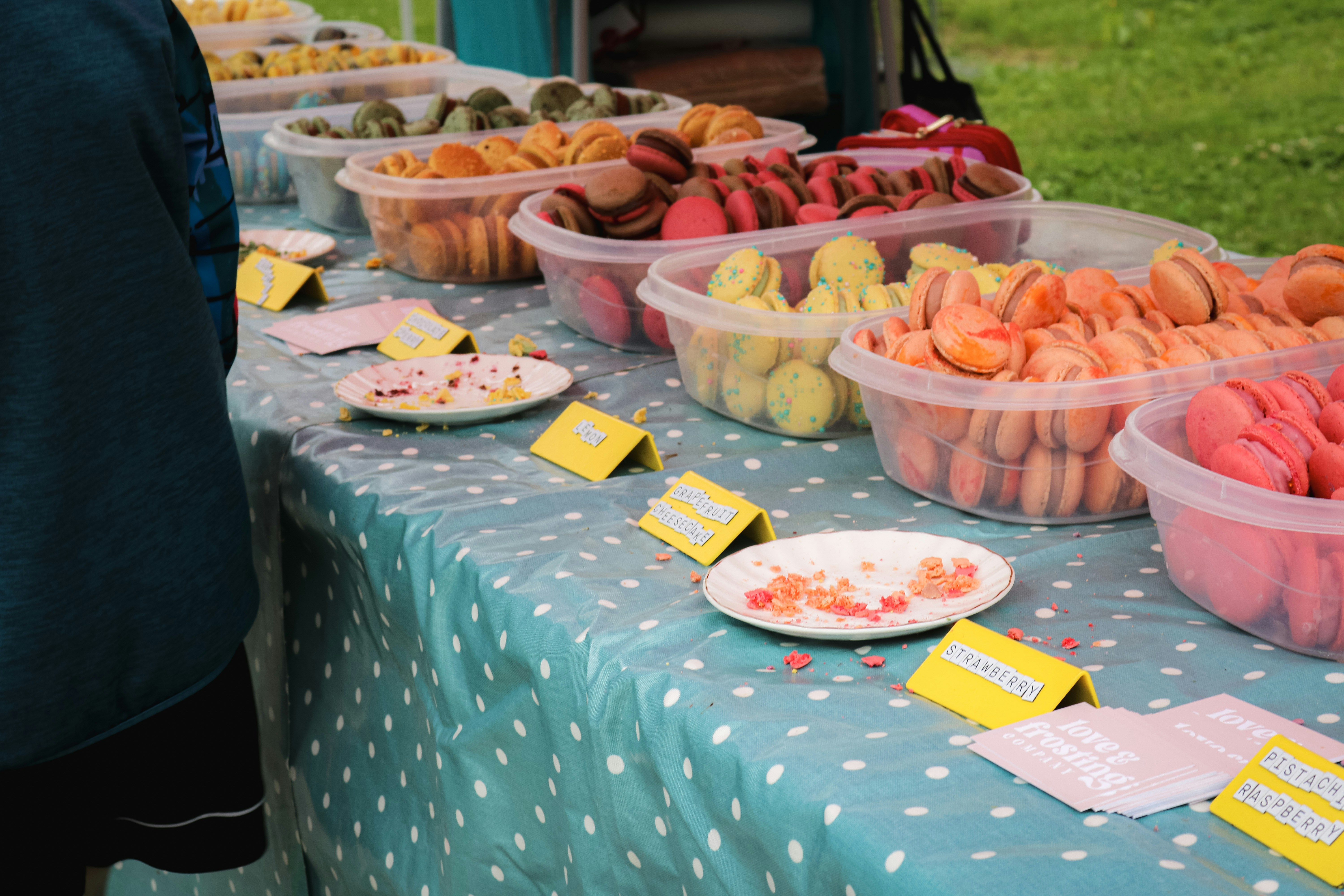 Rainbow Macarons Parade on a Polka-Dot Market Table