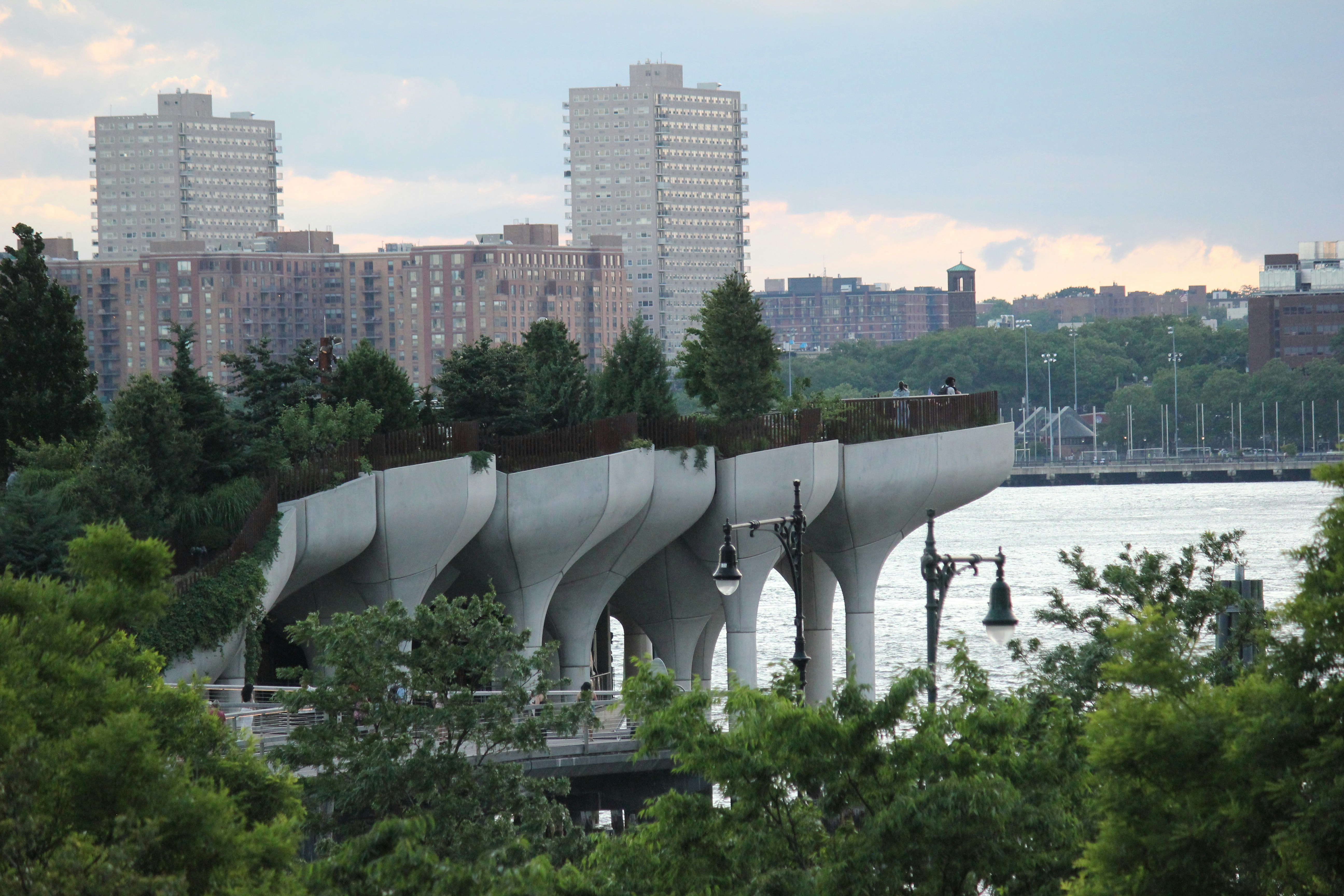 Urban Arc: The Curved Viaduct Framed Against River and Skyline