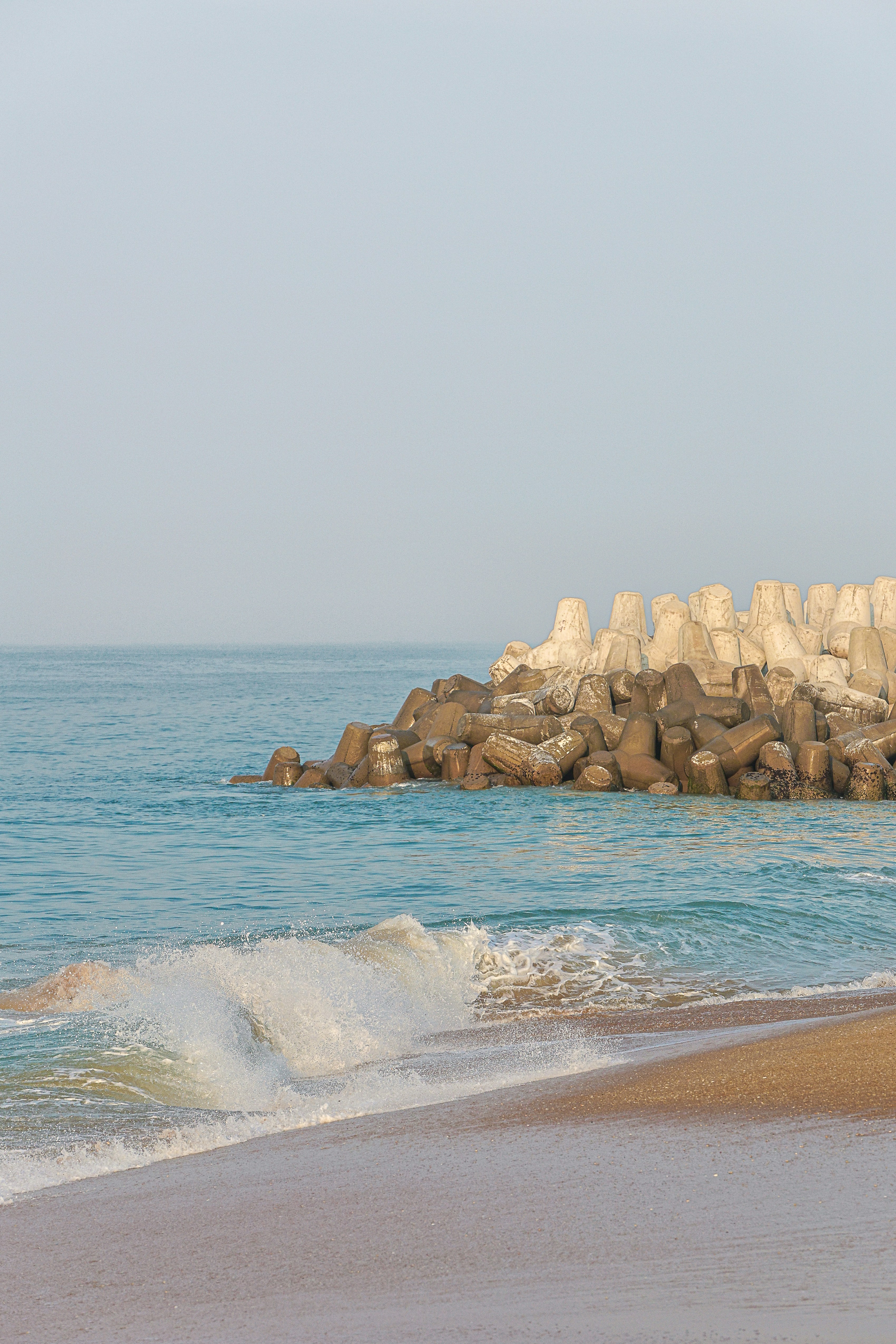 Coastal Breakwater: Waves Meet the Stone Barrier