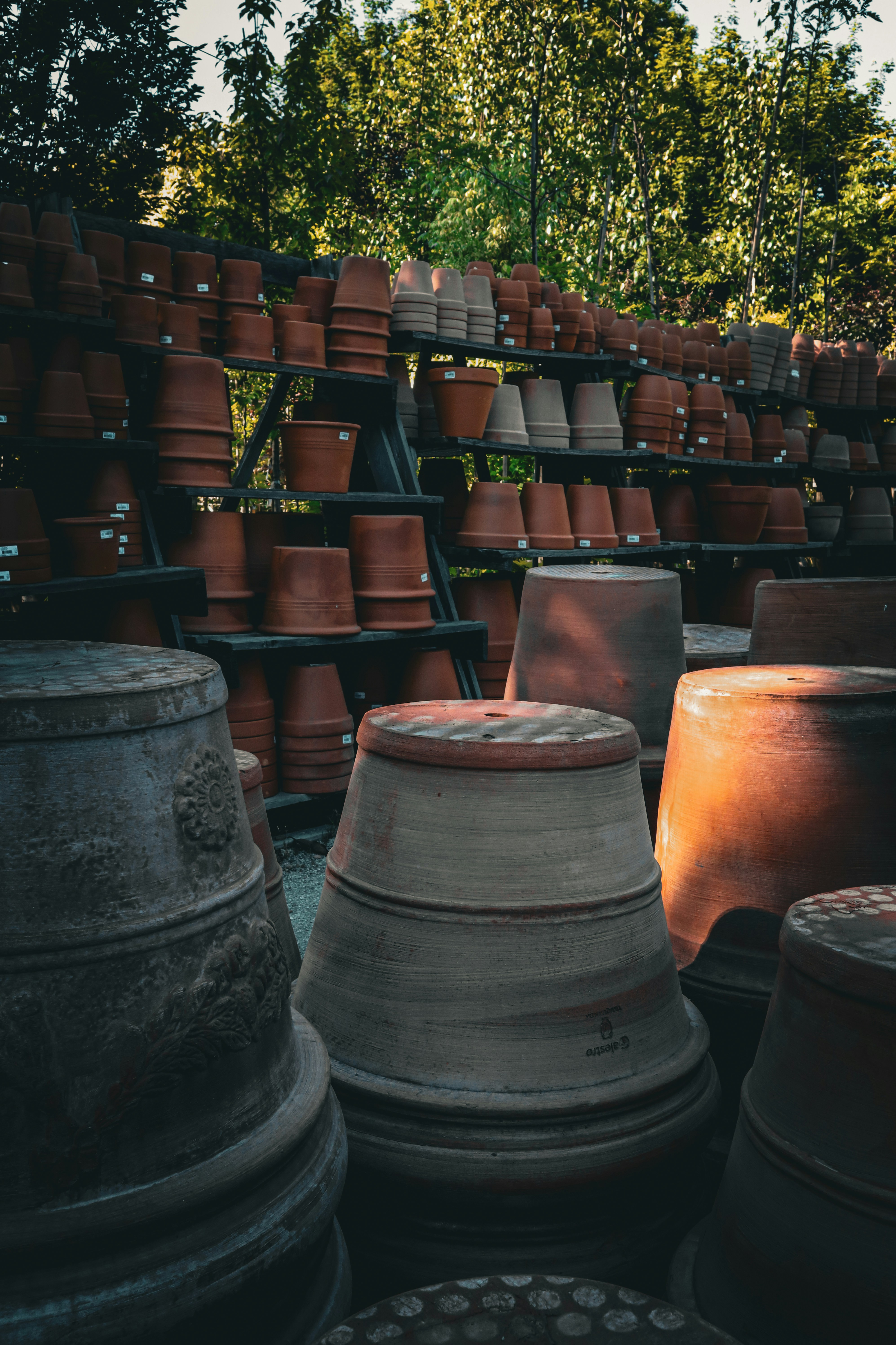 A bunch of pots that are sitting in the dirt photo – Free Garden Image ...