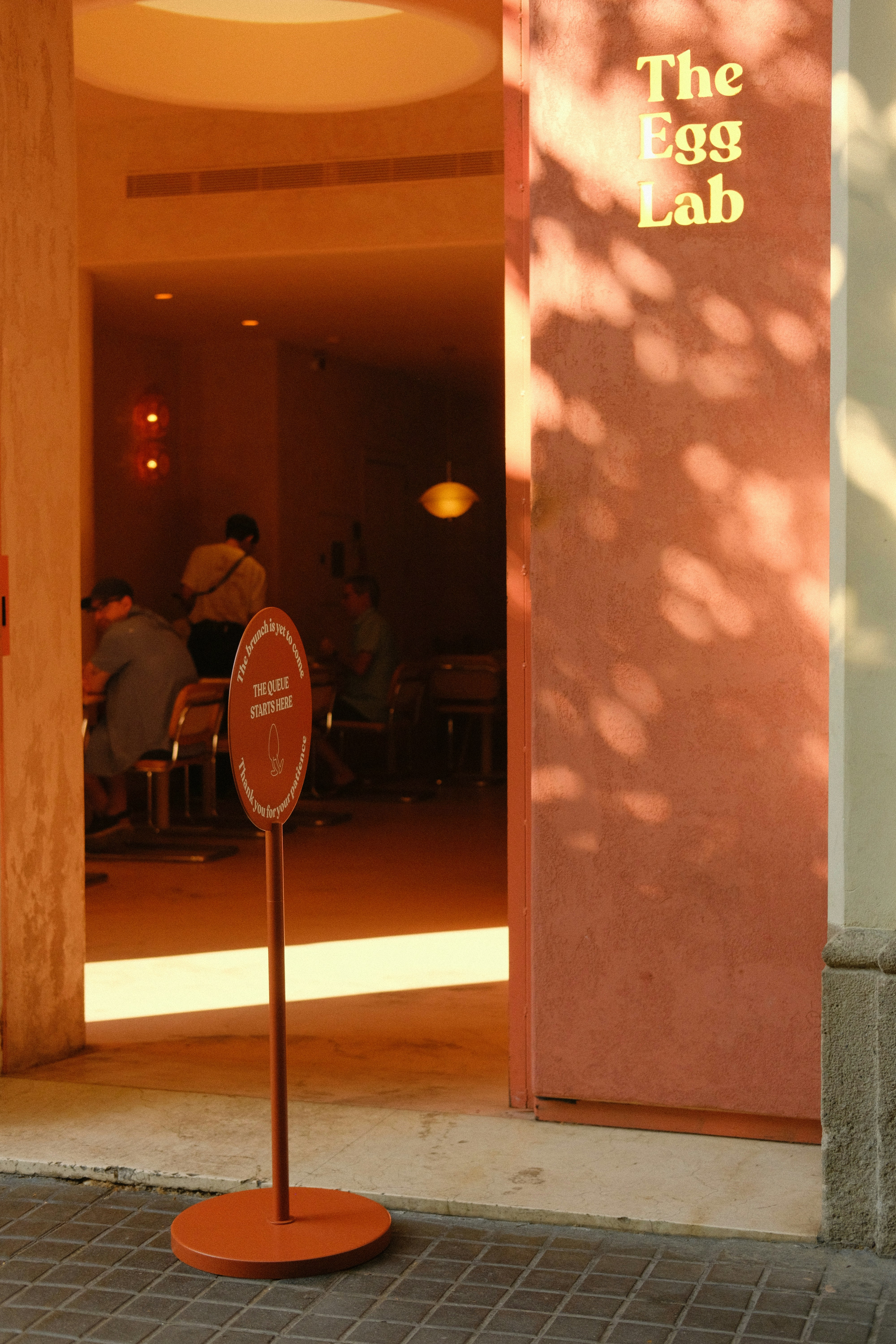 A sign in front of a building that says the egg lab photo – Free The ...