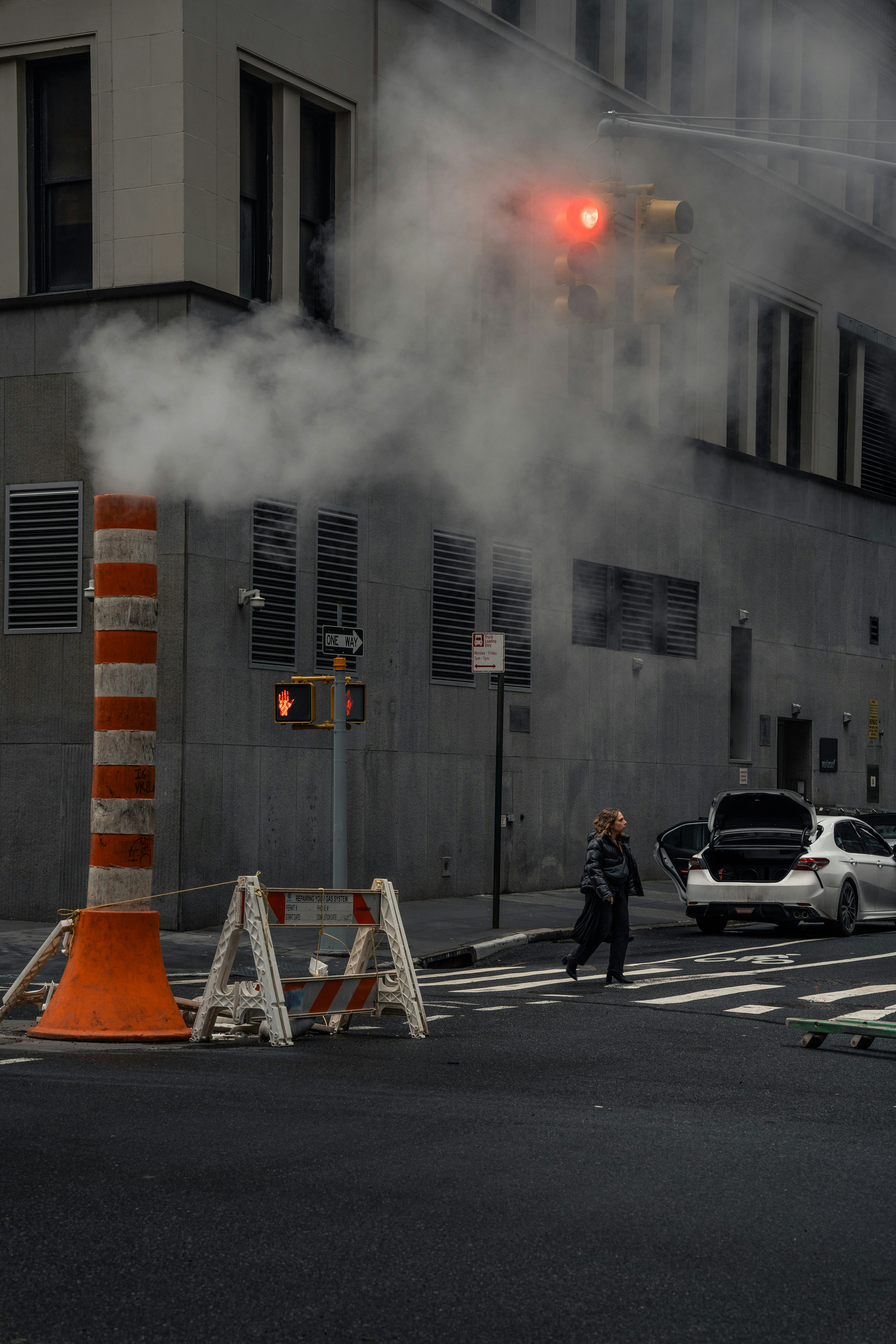 Red Light Through the Steam: Urban Street Scene at a Crosswalk
